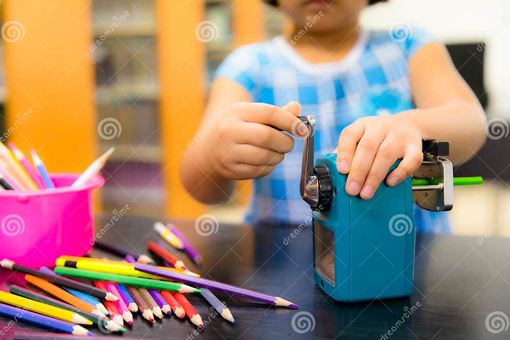 Children are Sharpening Crayons in the Library Stock Image - Image of ...
