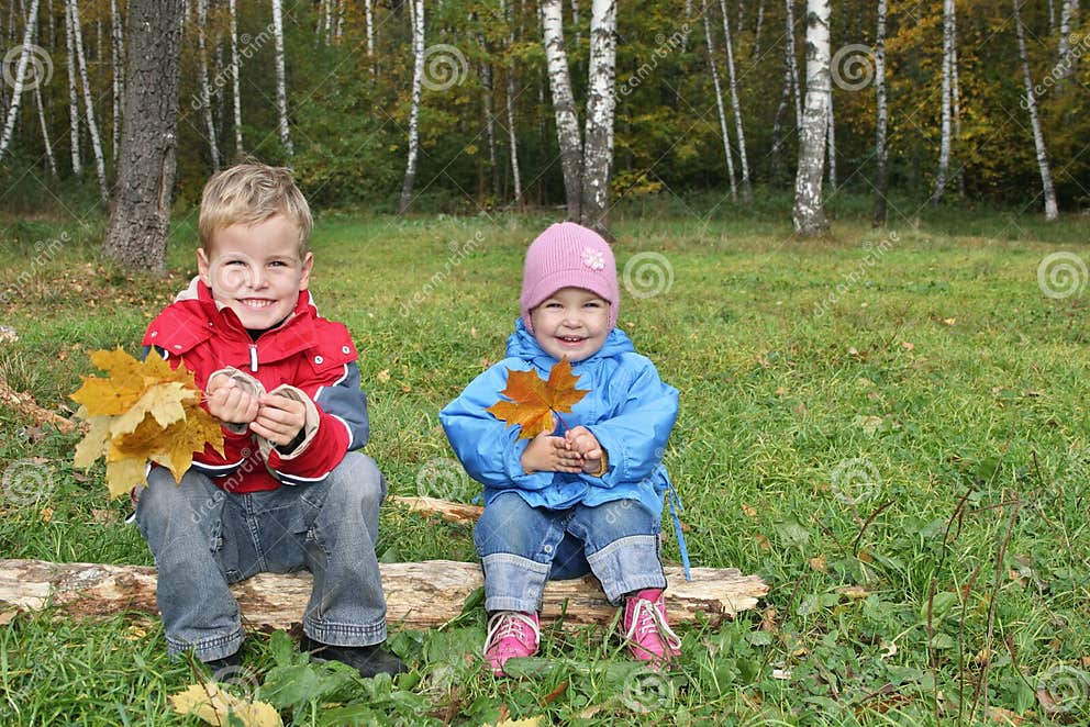 Children sit stock photo. Image of autumn, fist, dressed - 1346530