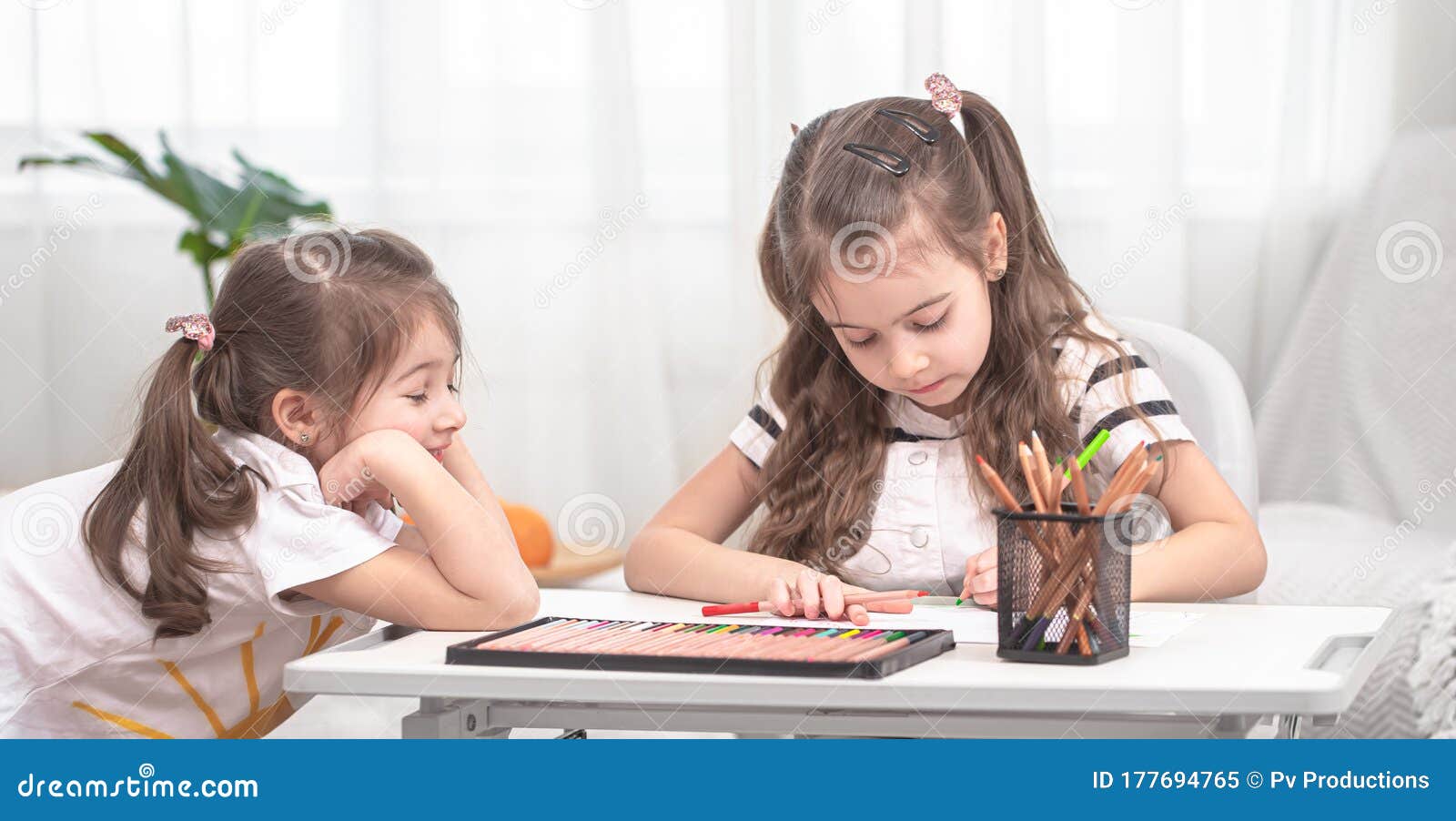 Children Sit at the Table and Do Their Homework. the Child Learns at ...