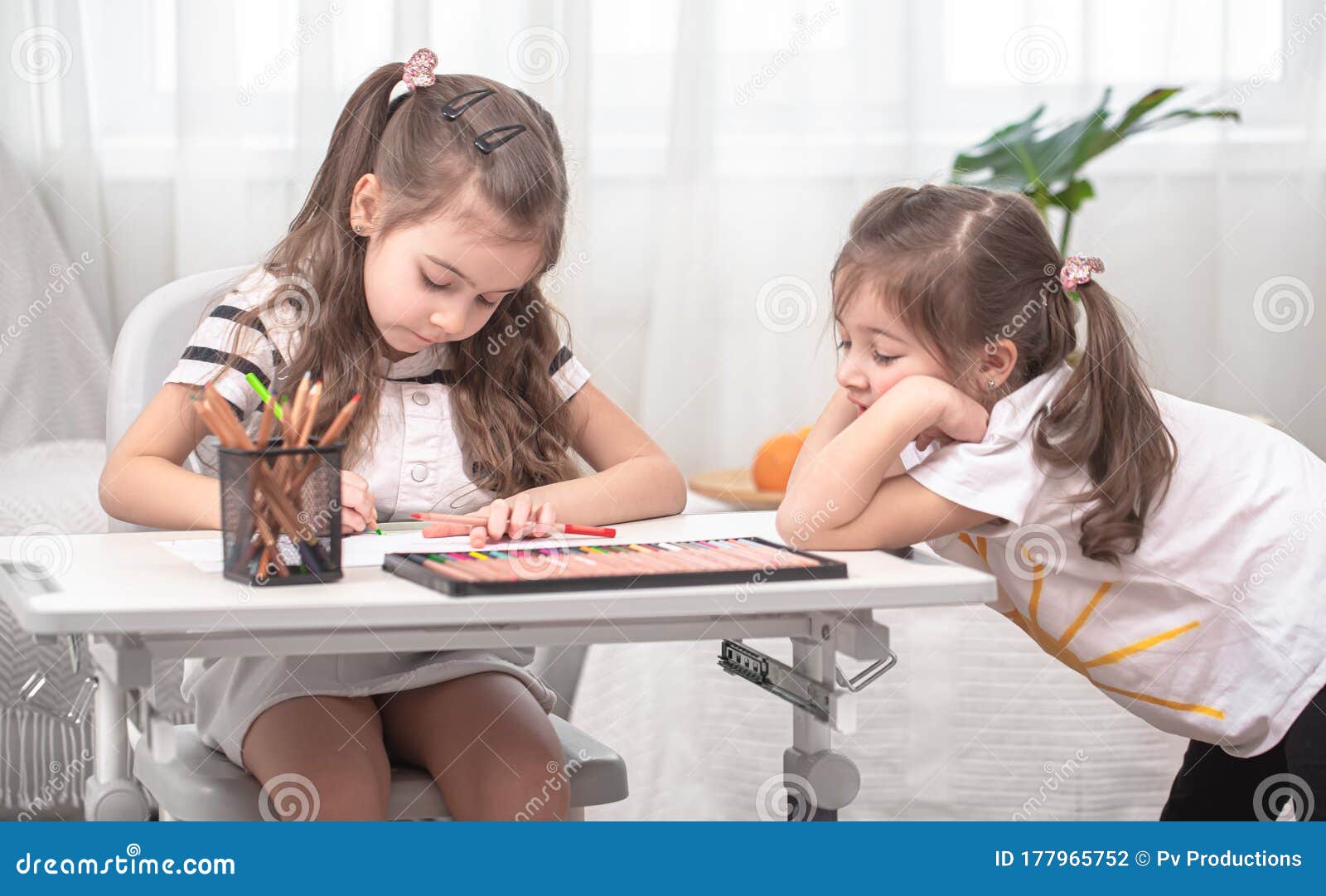 Children Sit at the Table and Do Their Homework. the Child Learns at ...