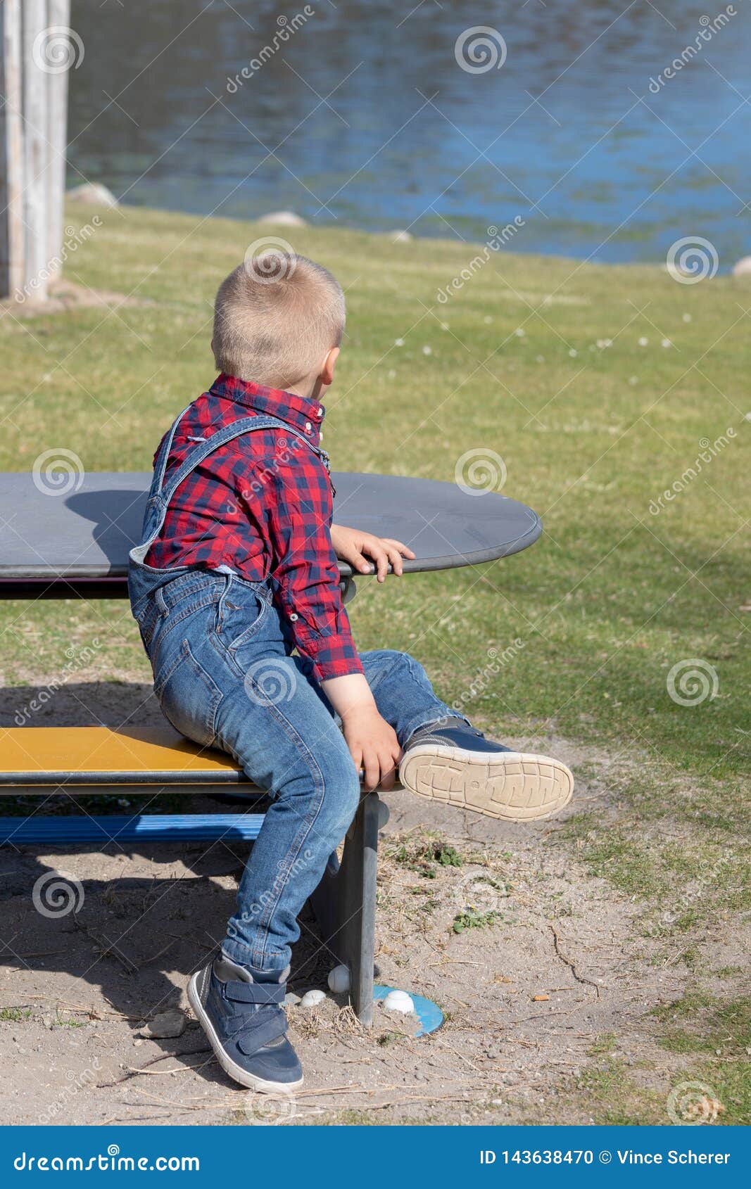 Children Sit on a Wooden Bench in the Open Air Stock Photo - Image of ...