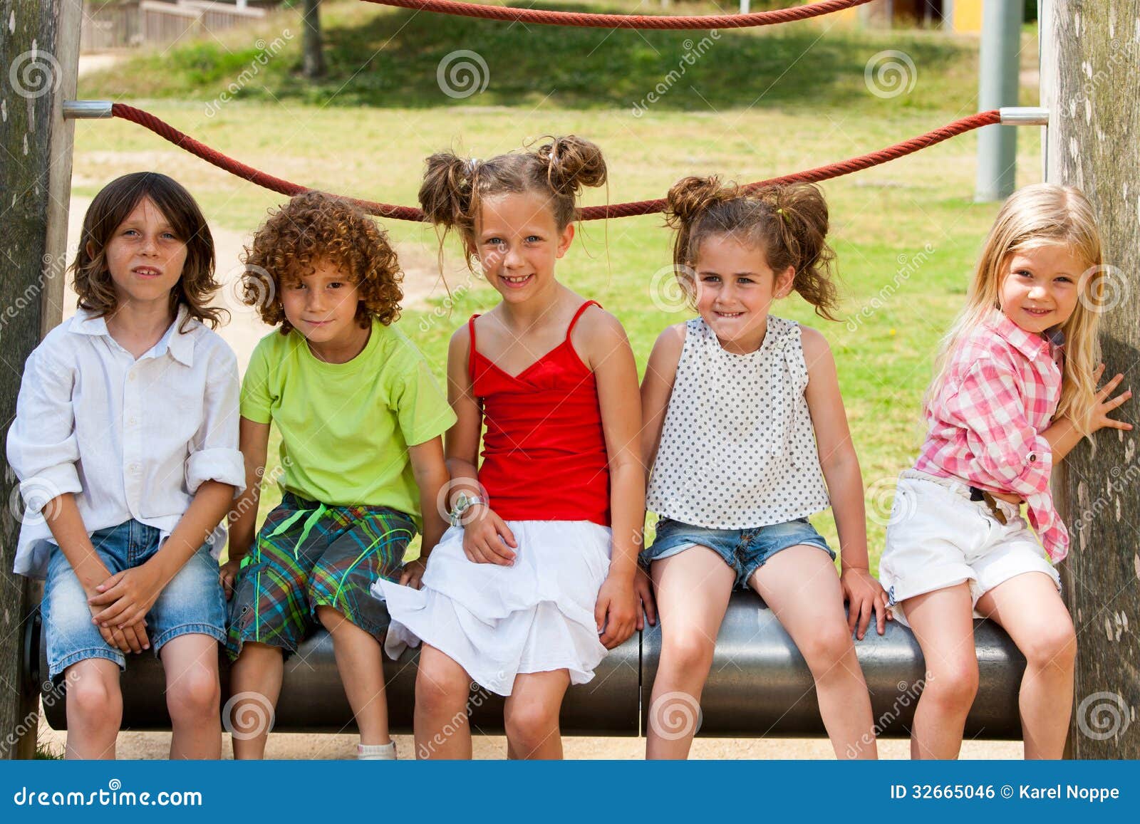 Children Siting Together in Park. Stock Photo - Image of girls ...