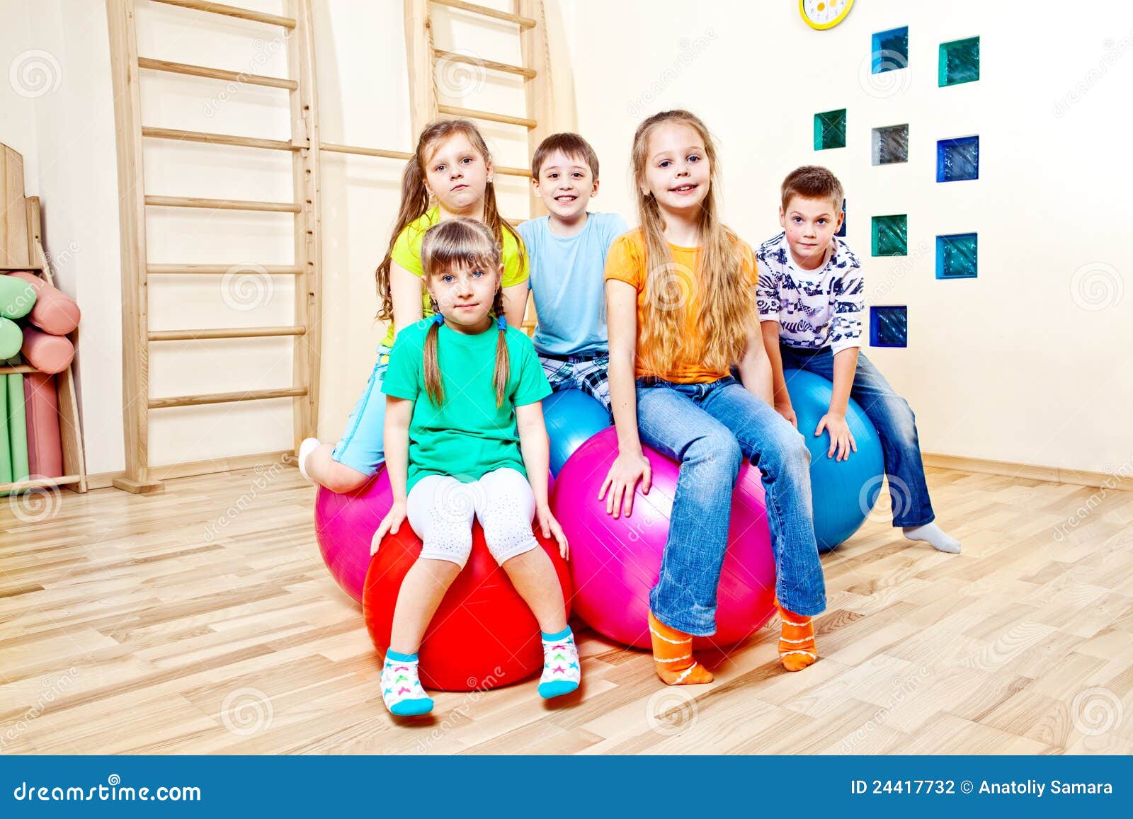 Children sitting on balls stock photo. Image of lovely - 24417732