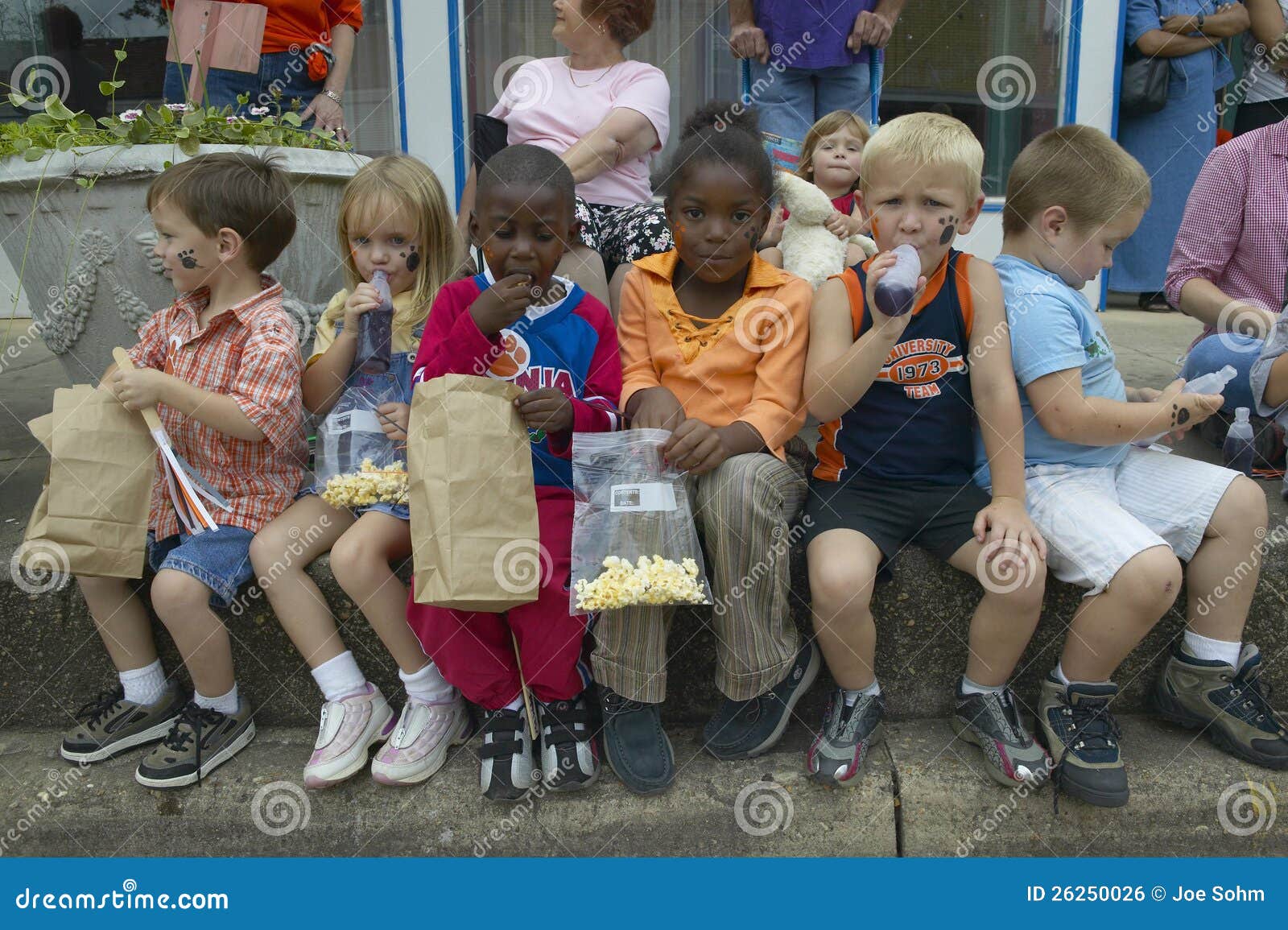 Children sitting at parade editorial photo. Image of festivities - 26250026