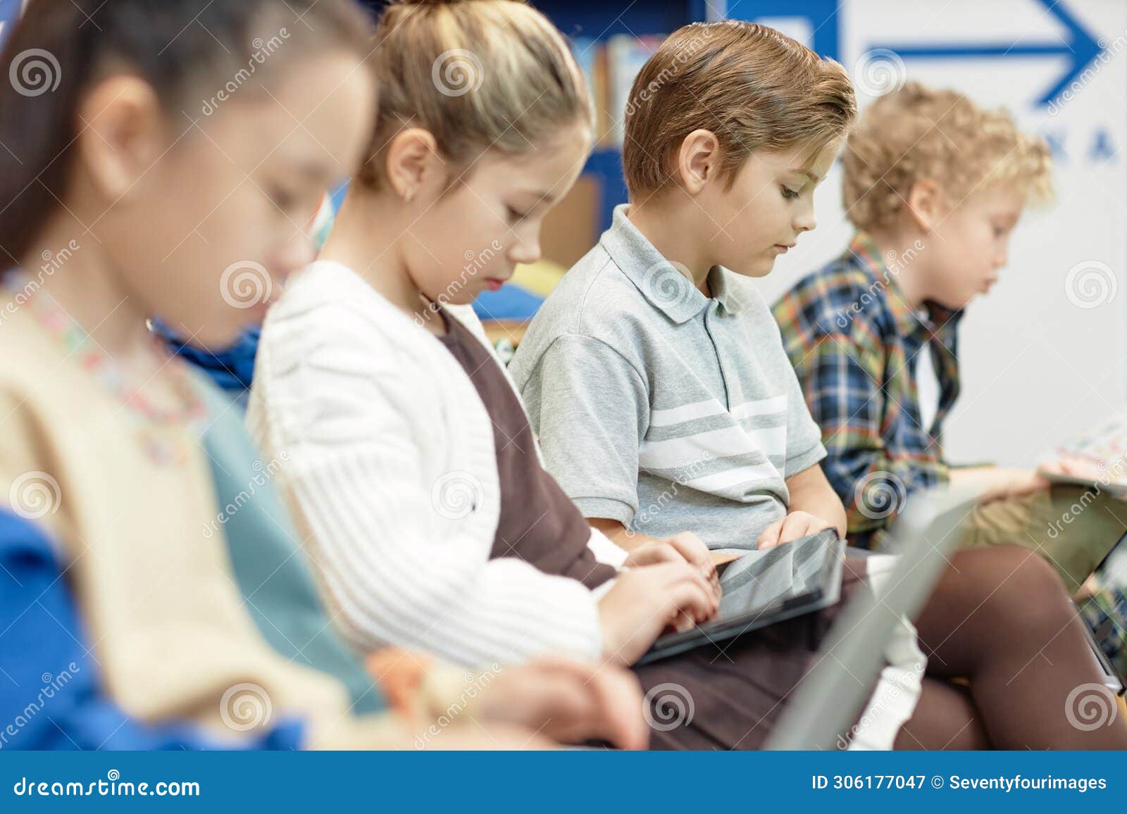 Children Sitting in Row at Library and Using Computers Stock Image ...