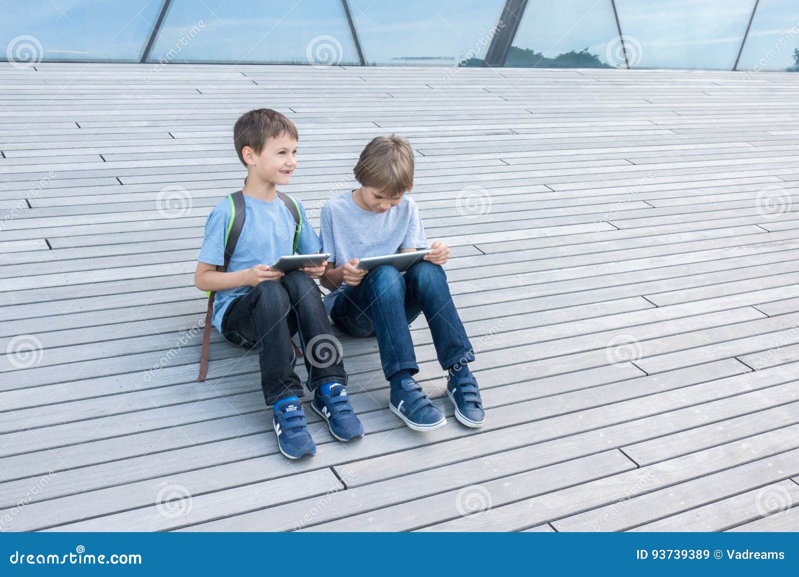 Children Sitting with Tablet Computers in the City Outdoors Stock Image ...