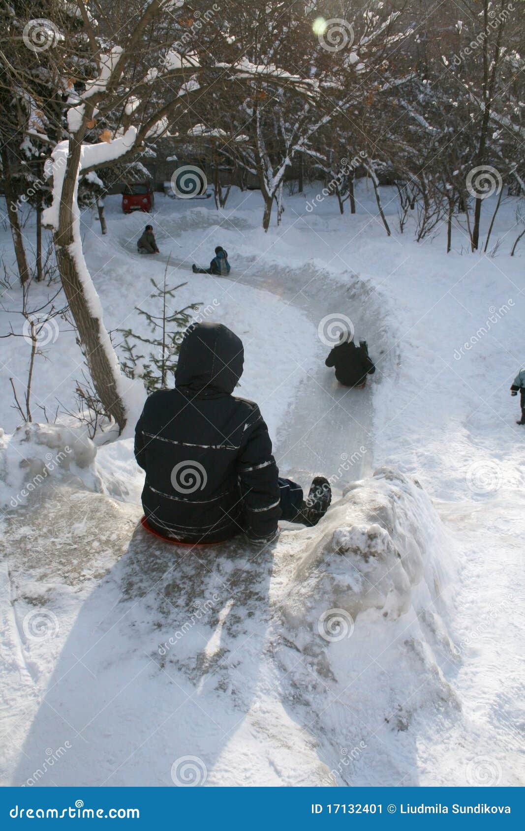 Children sledding downhill stock image. Image of action - 17132401