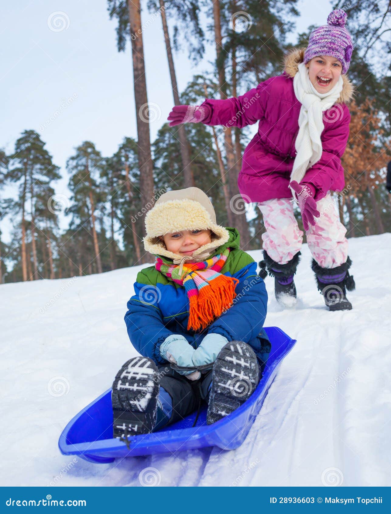 Children on sleds in snow stock image. Image of eyes - 28936603