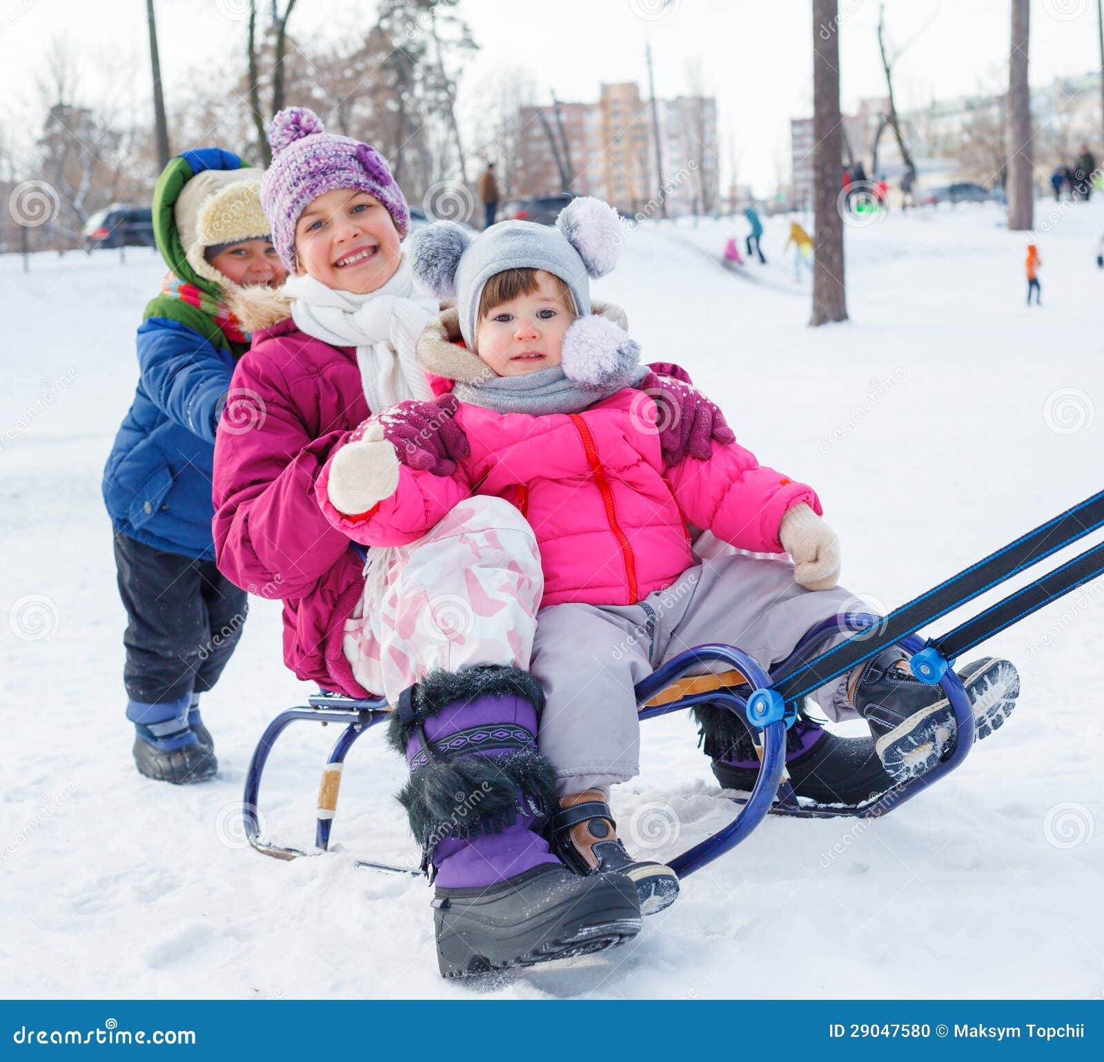 Children on sleds in snow stock photo. Image of cheerful - 29047580