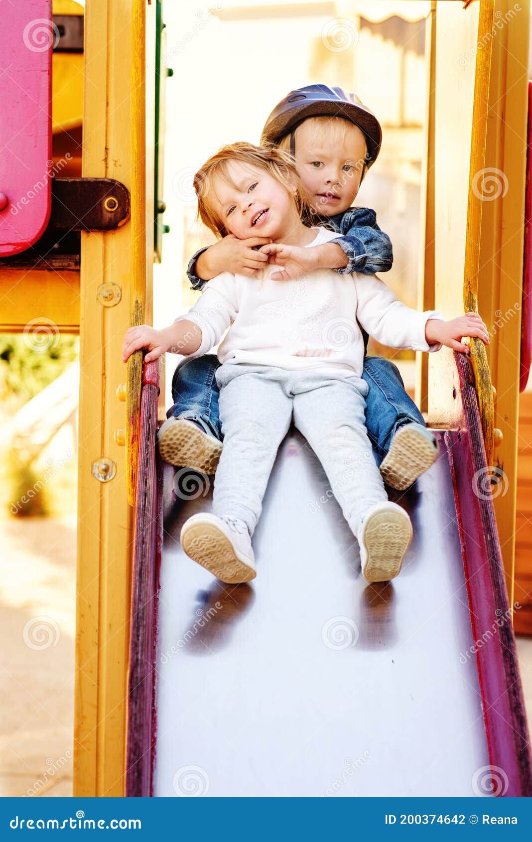Children on the slide stock photo. Image of nursery - 200374642