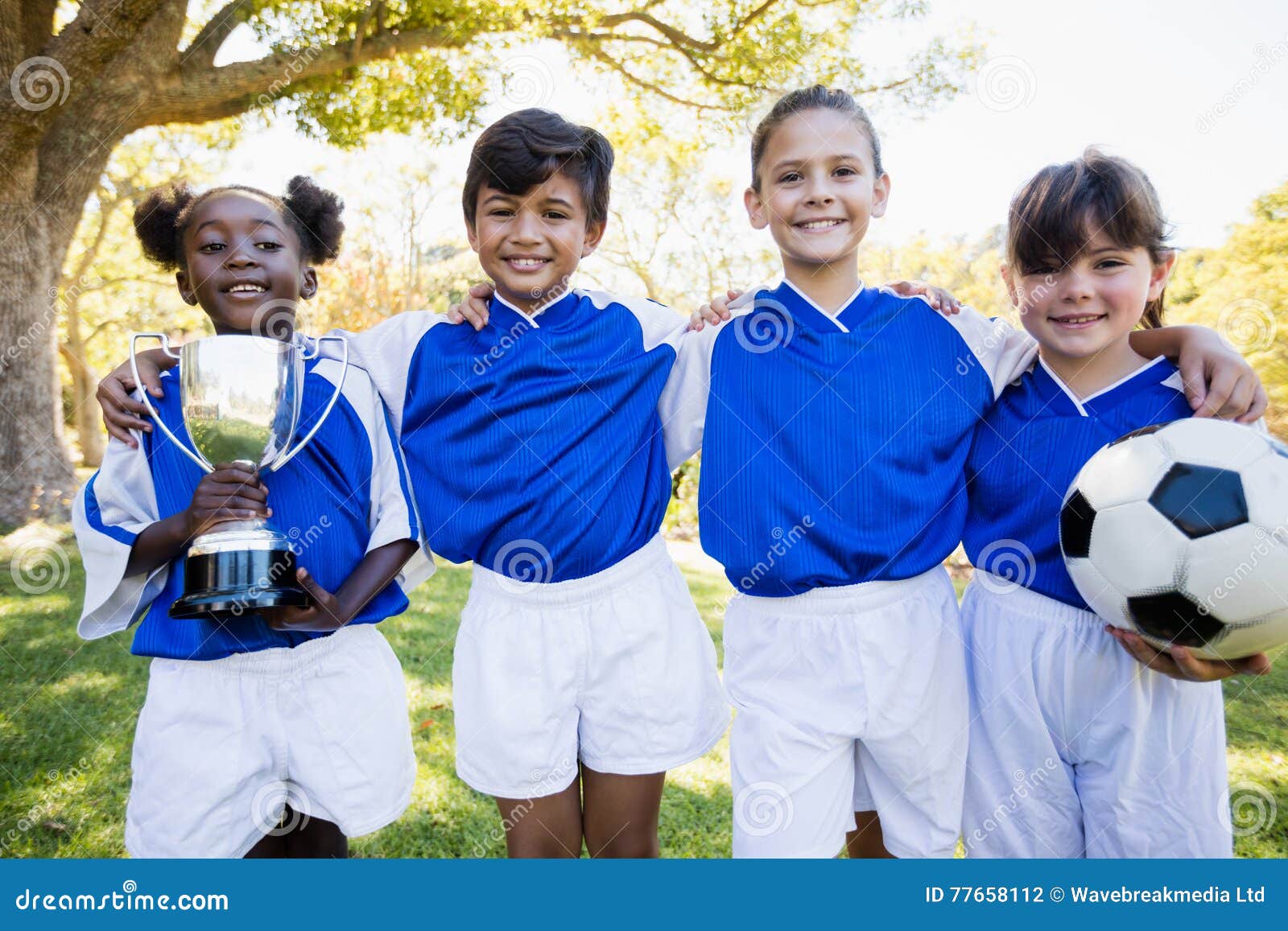 Children Soccer Team in Raw Smiling Stock Photo - Image of balloon ...