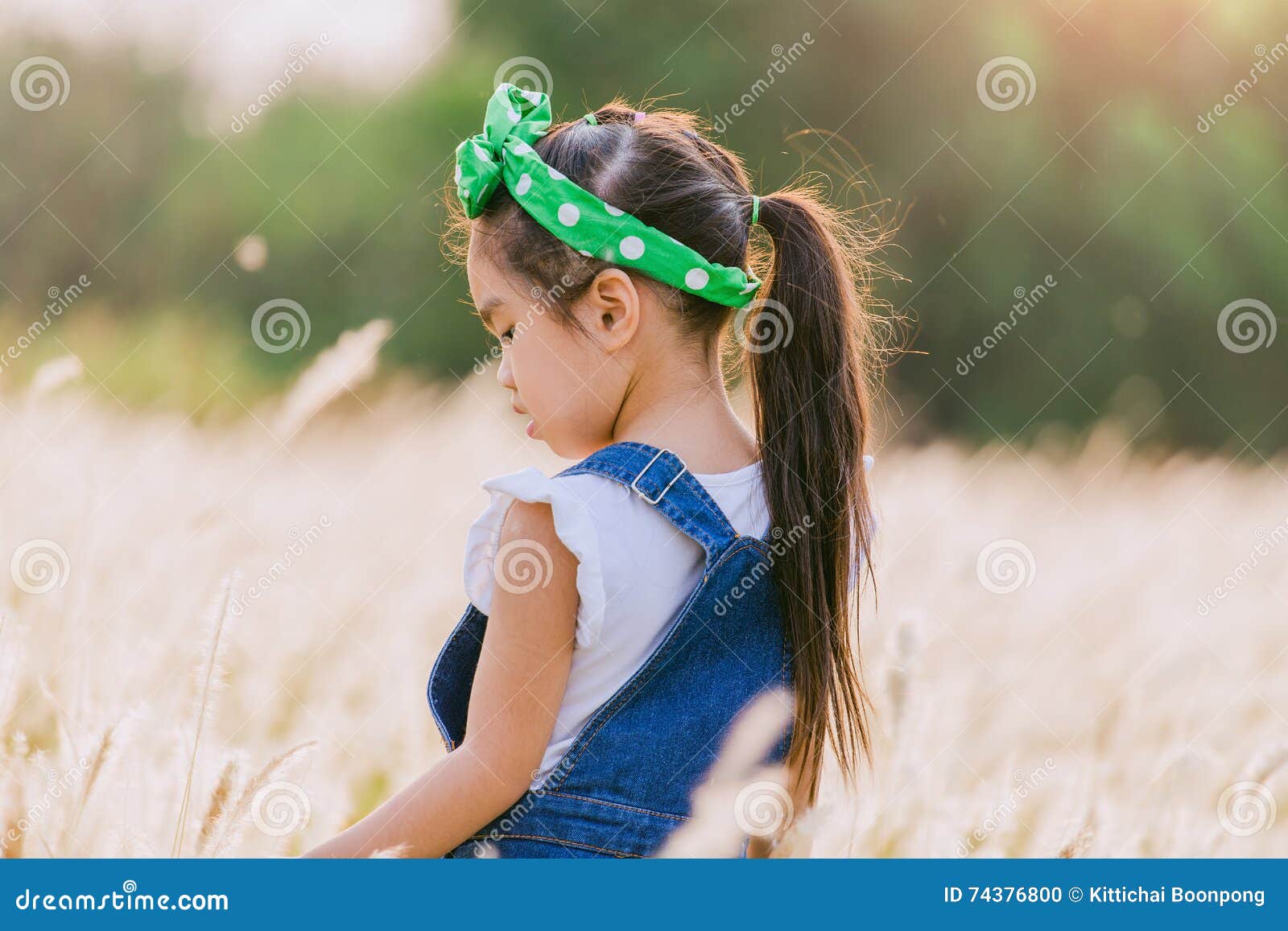 Children Standing Alone at the Field during Beautiful Sunset Stock ...