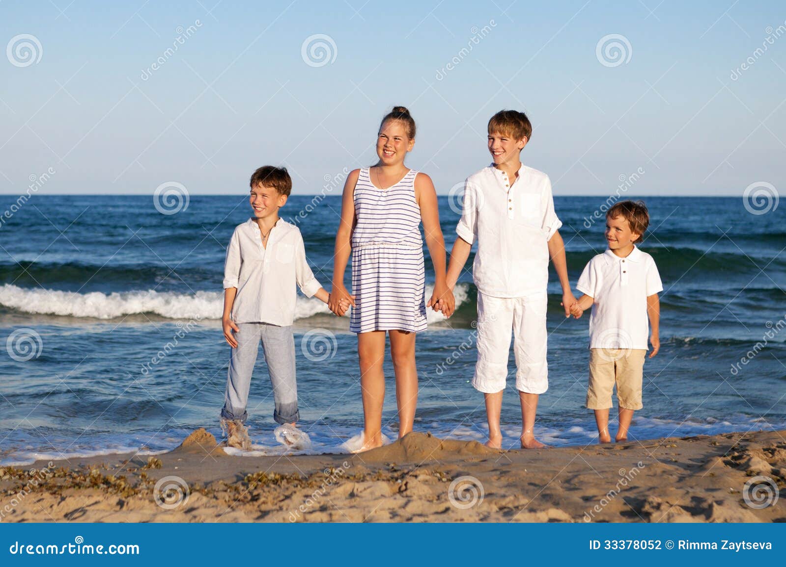 Children are Standing on Beach Stock Photo - Image of sand, sibling ...