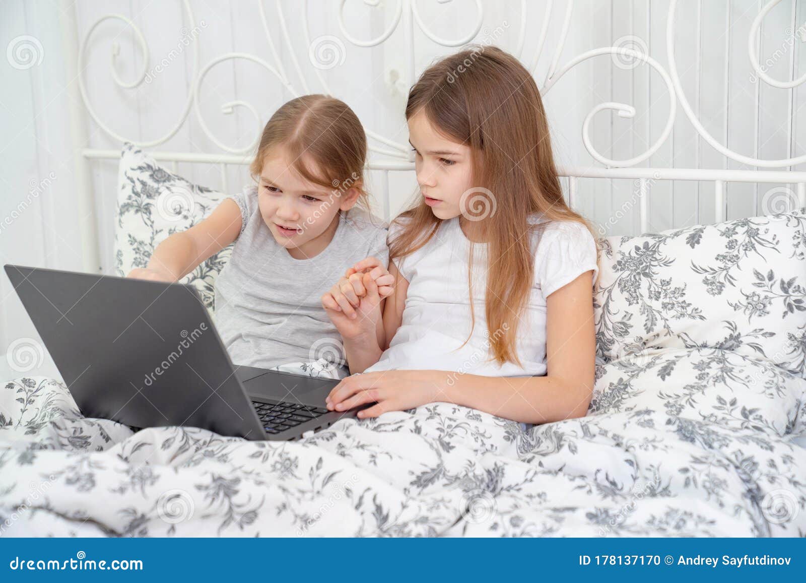 Children Study on Computer Online at Home Bed. Stock Photo - Image of ...