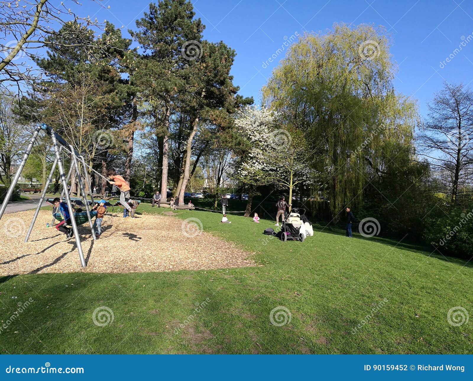 Children Swinging Under the Germany Sun Editorial Photography - Image ...