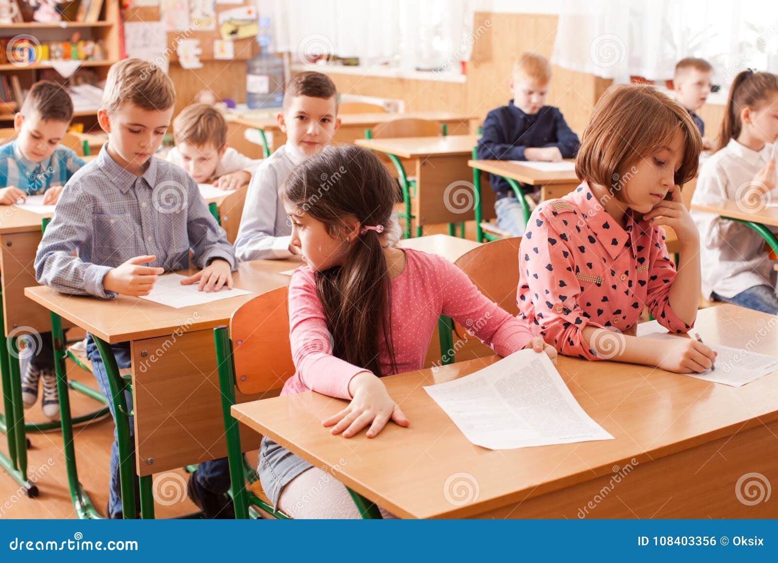 Children taking an exam stock photo. Image of pupil - 108403356