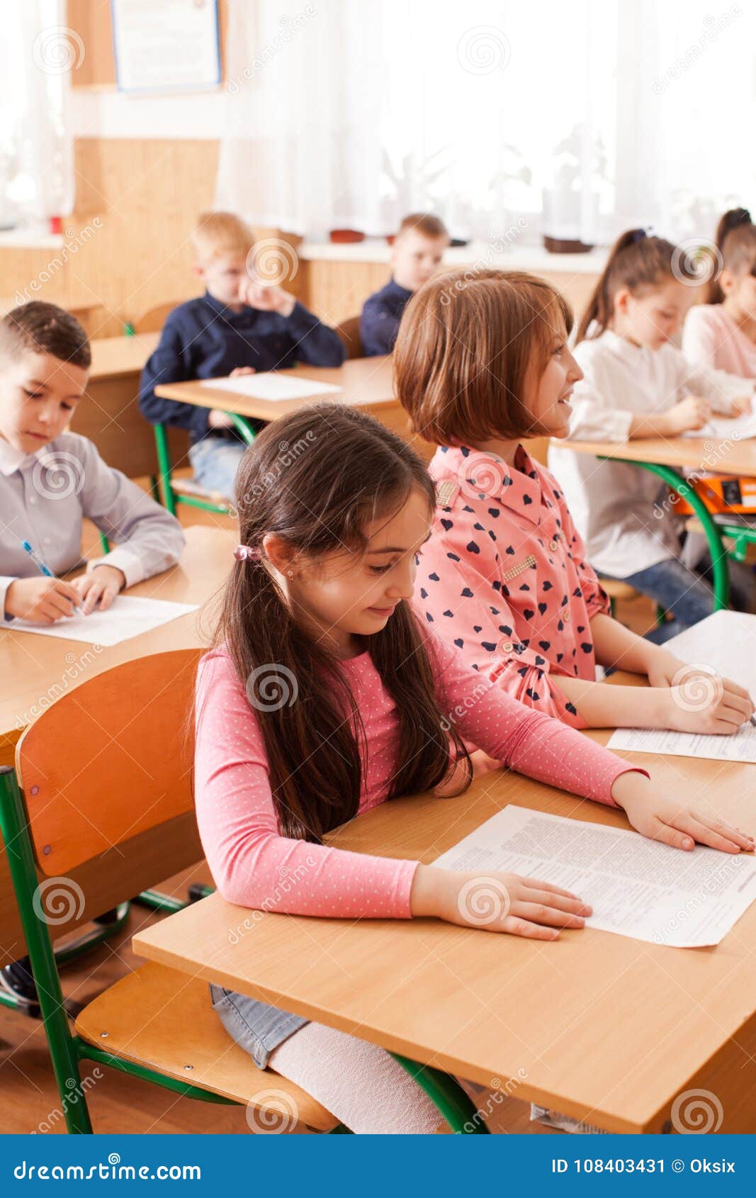 Children taking an exam stock image. Image of lesson - 108403431