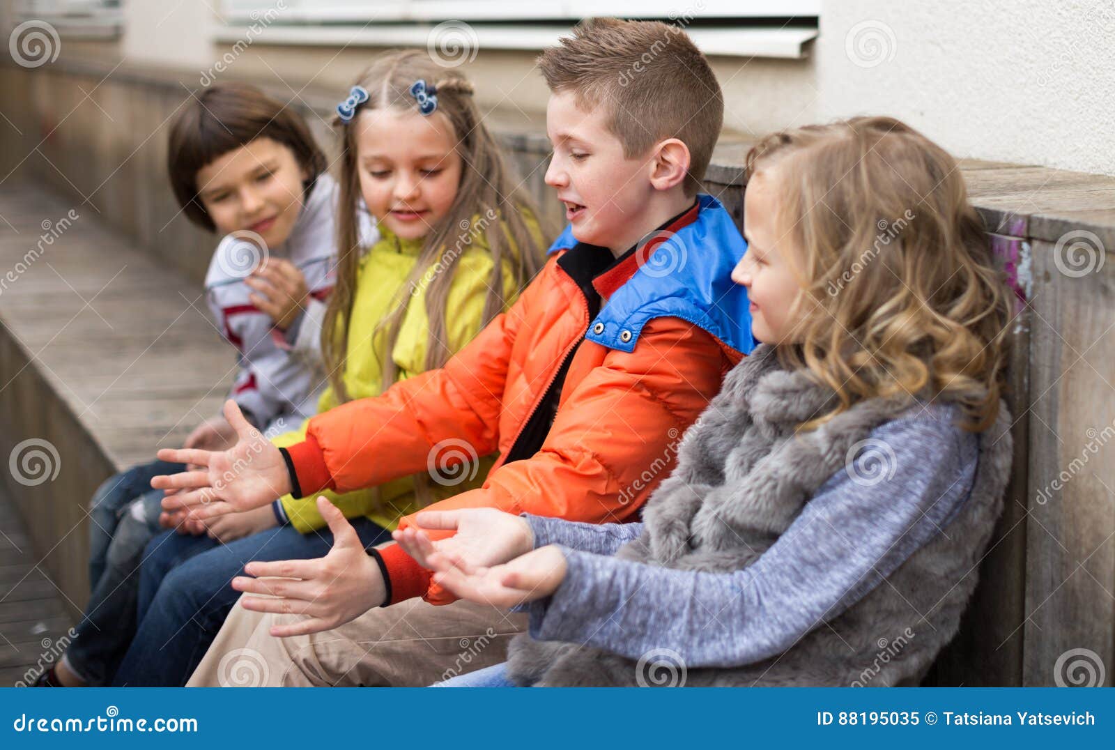 Children talking on bench stock image. Image of laughing - 88195035