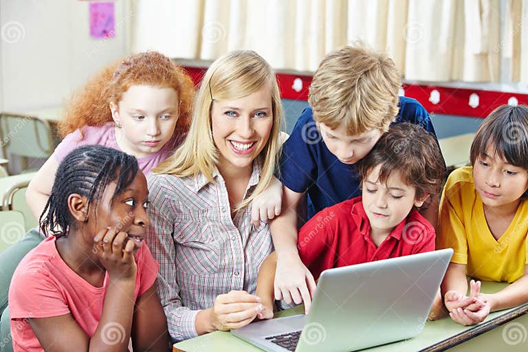 Children with Teacher in Computer Stock Image - Image of pupil ...