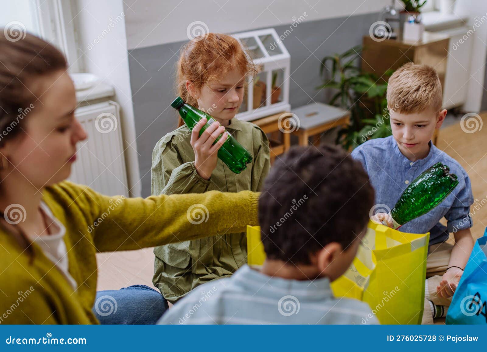 Children with Teacher Separating Rubish in To Three Bins. Stock Photo ...