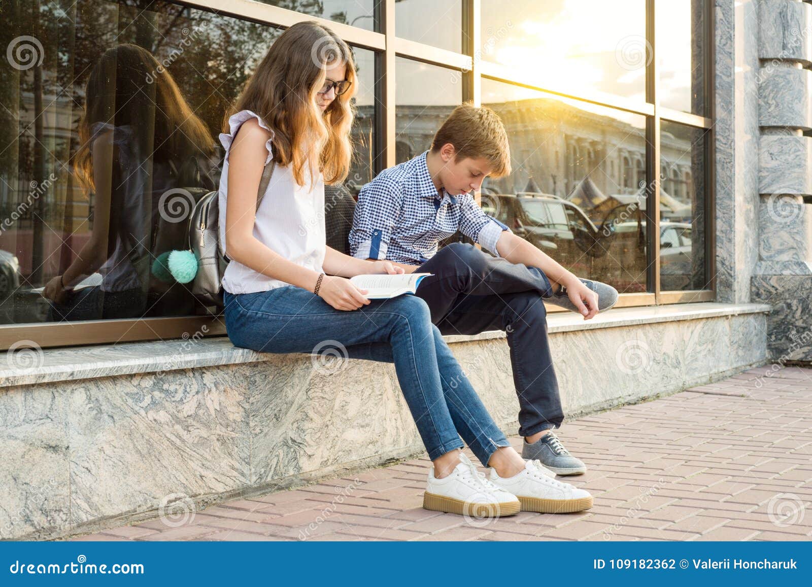 Children Teenagers. Break Reading Book and Using Smartphone. Stock ...