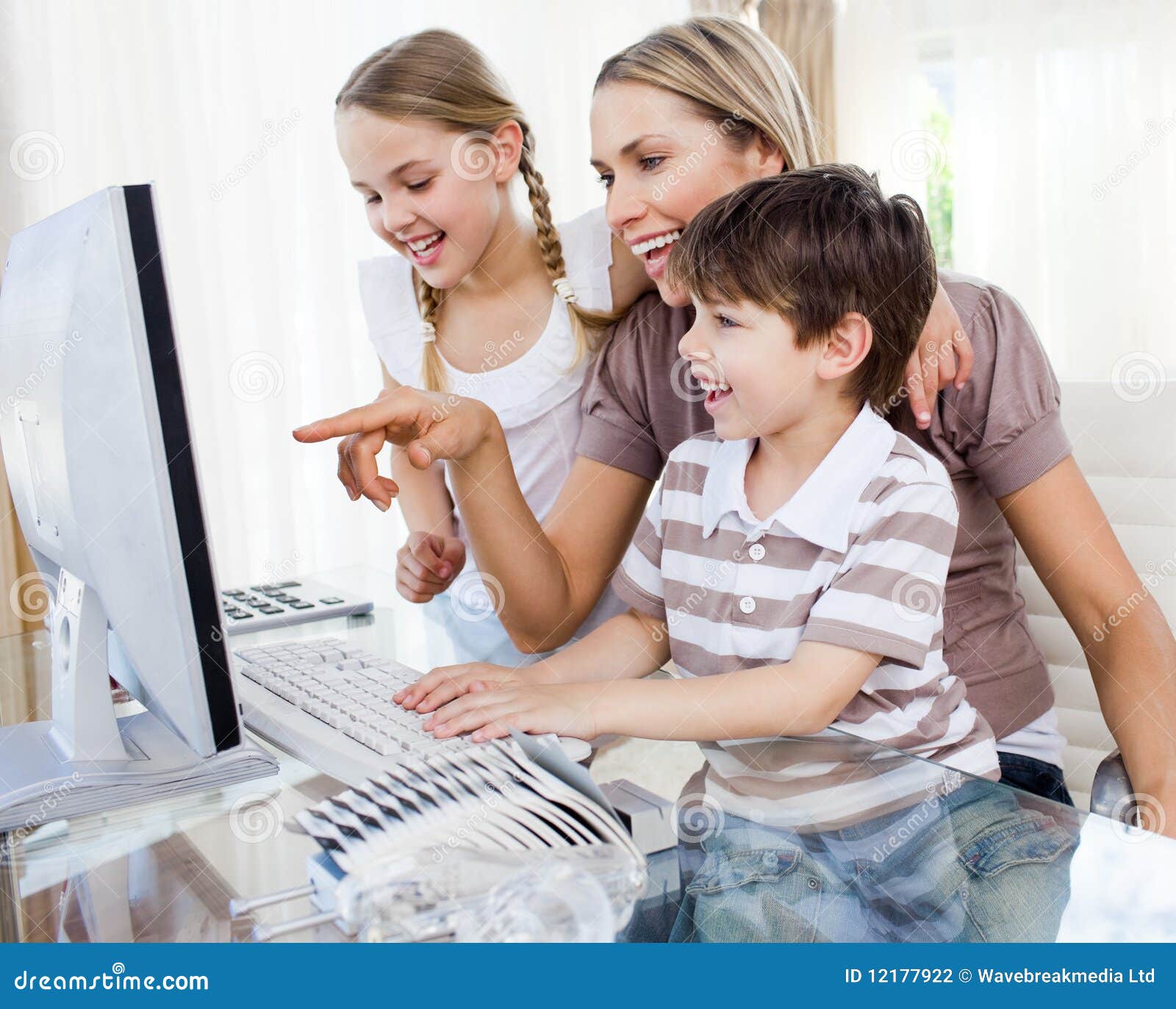 Children and Their Mother Using a Computer Stock Photo - Image of home ...