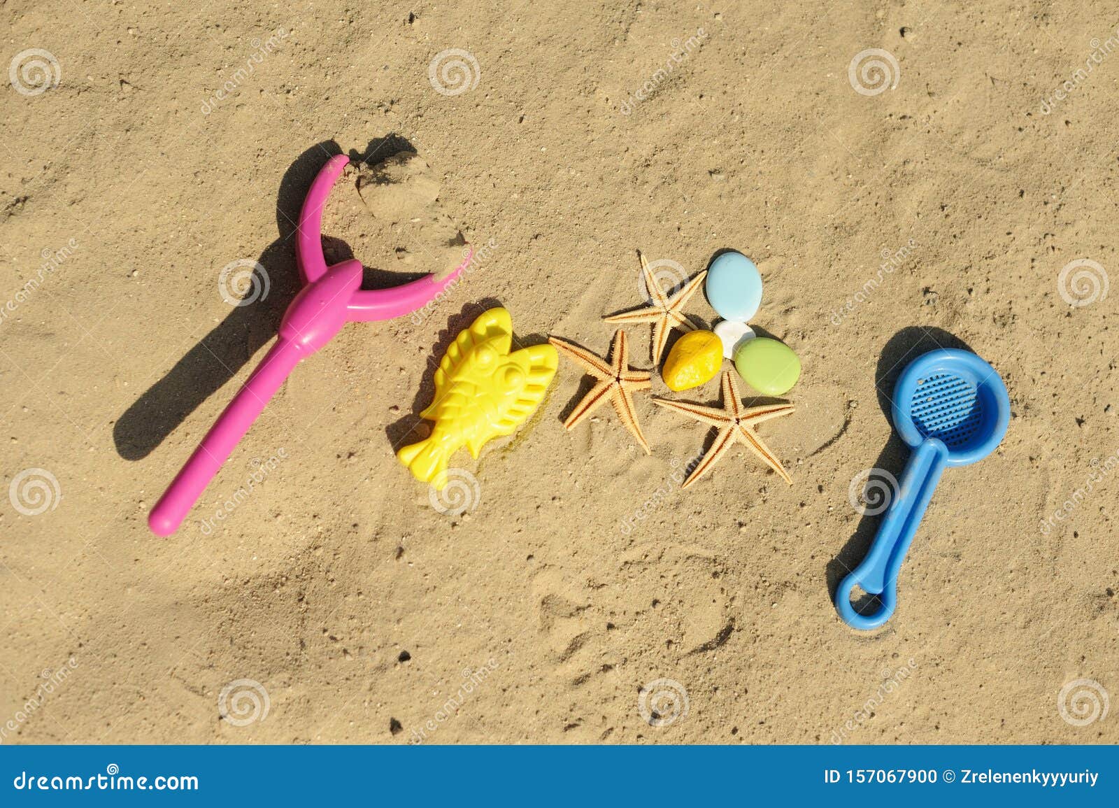 Children toys on sand stock photo. Image of scoop, objects - 157067900