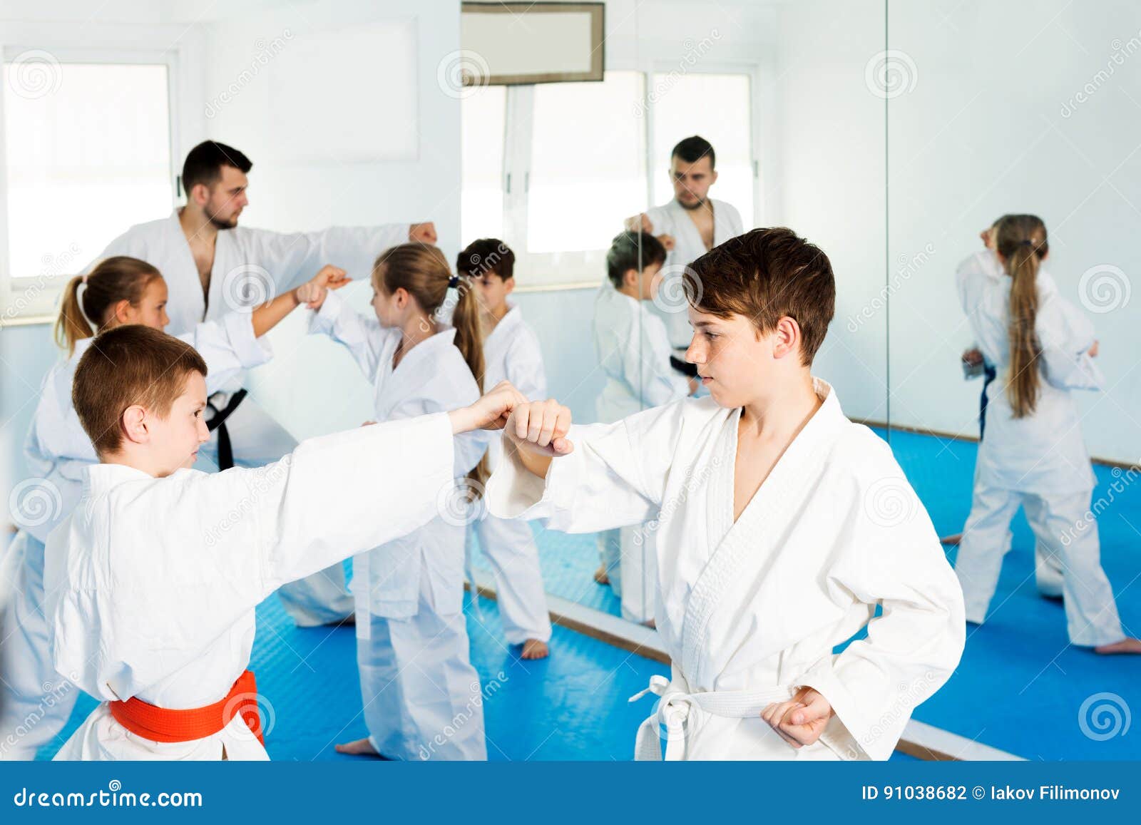 Children training in pairs stock photo. Image of authentic - 91038682