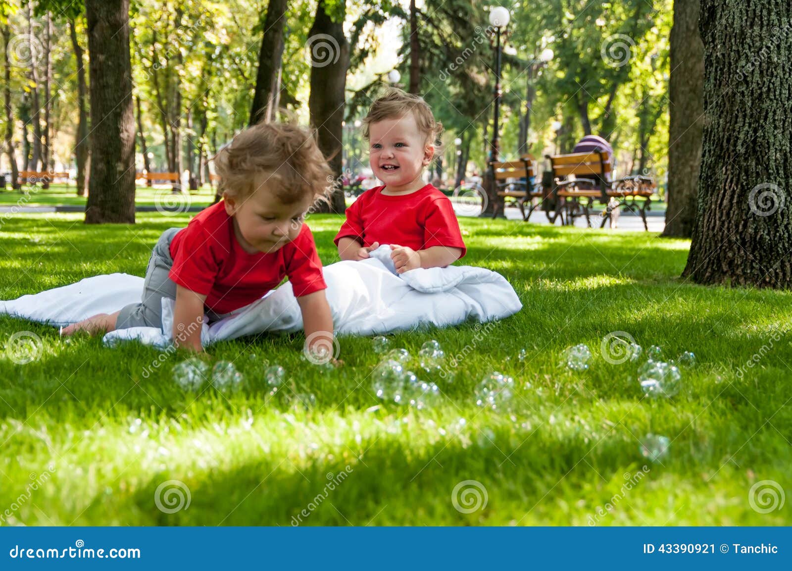 Children Twins Play On The Grass Stock Image | CartoonDealer.com #43390921
