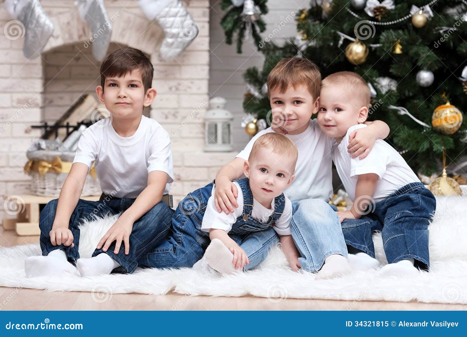 Children Under the Christmas Tree by the Fireplace Stock Image - Image ...