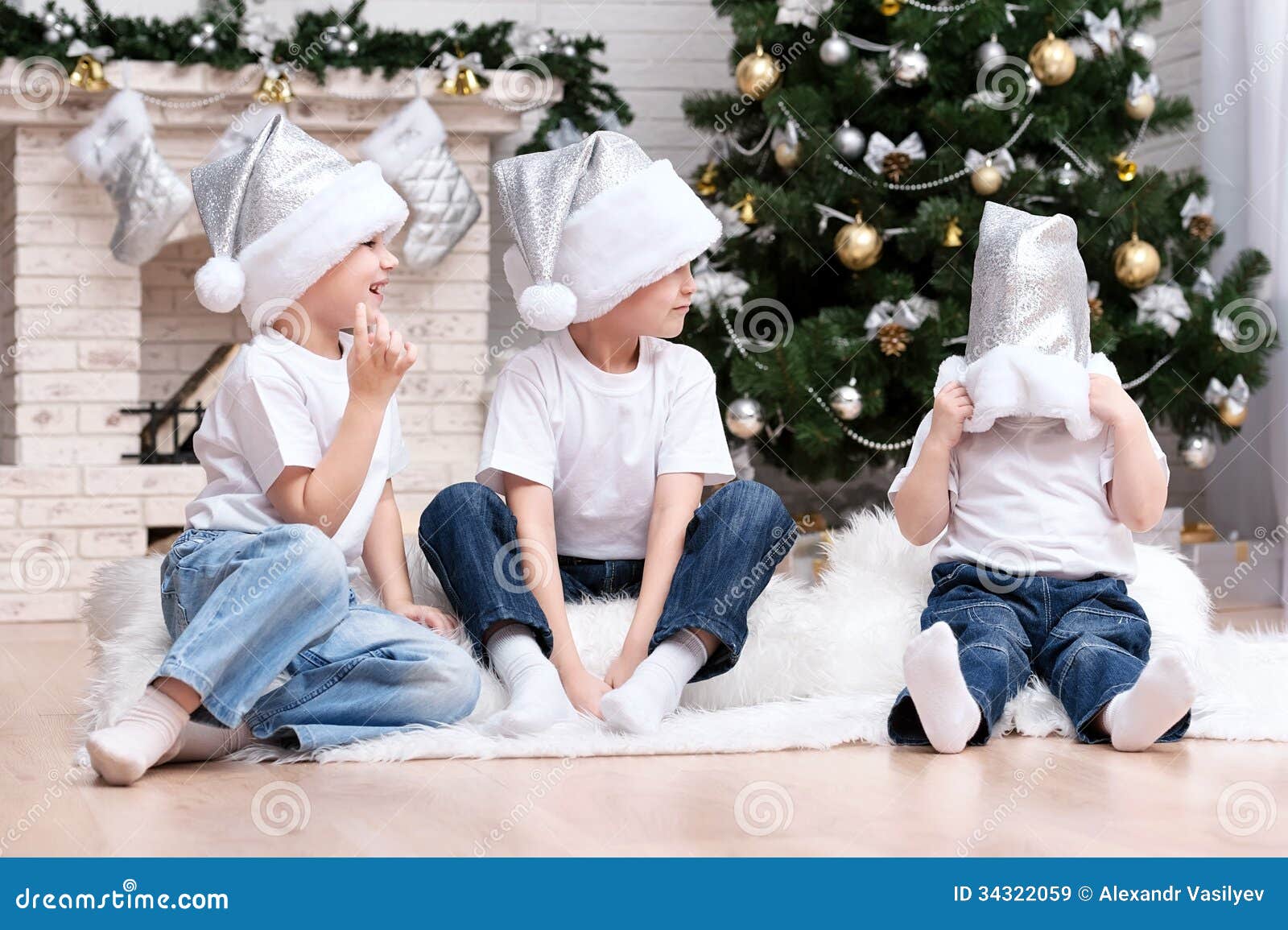 Children Under the Christmas Tree by the Fireplace Stock Image - Image ...