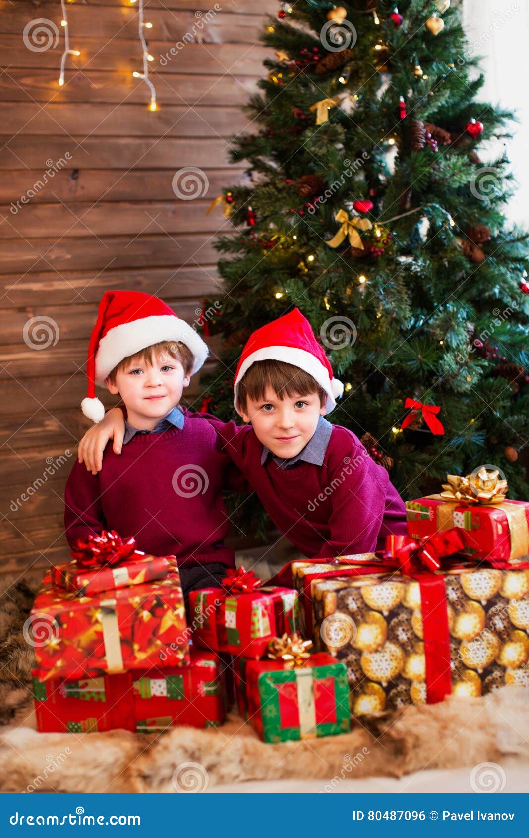 Children Under Christmas Tree with Gift Boxes. Stock Photo - Image of ...