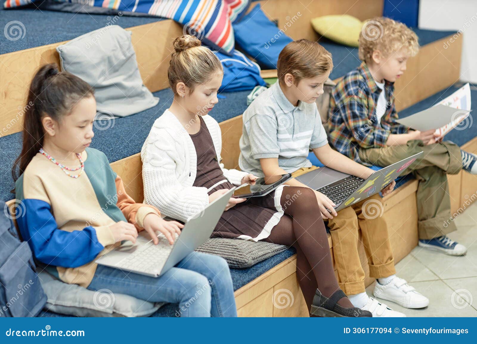 Children Using Computers Sitting in Row Stock Photo - Image of ...