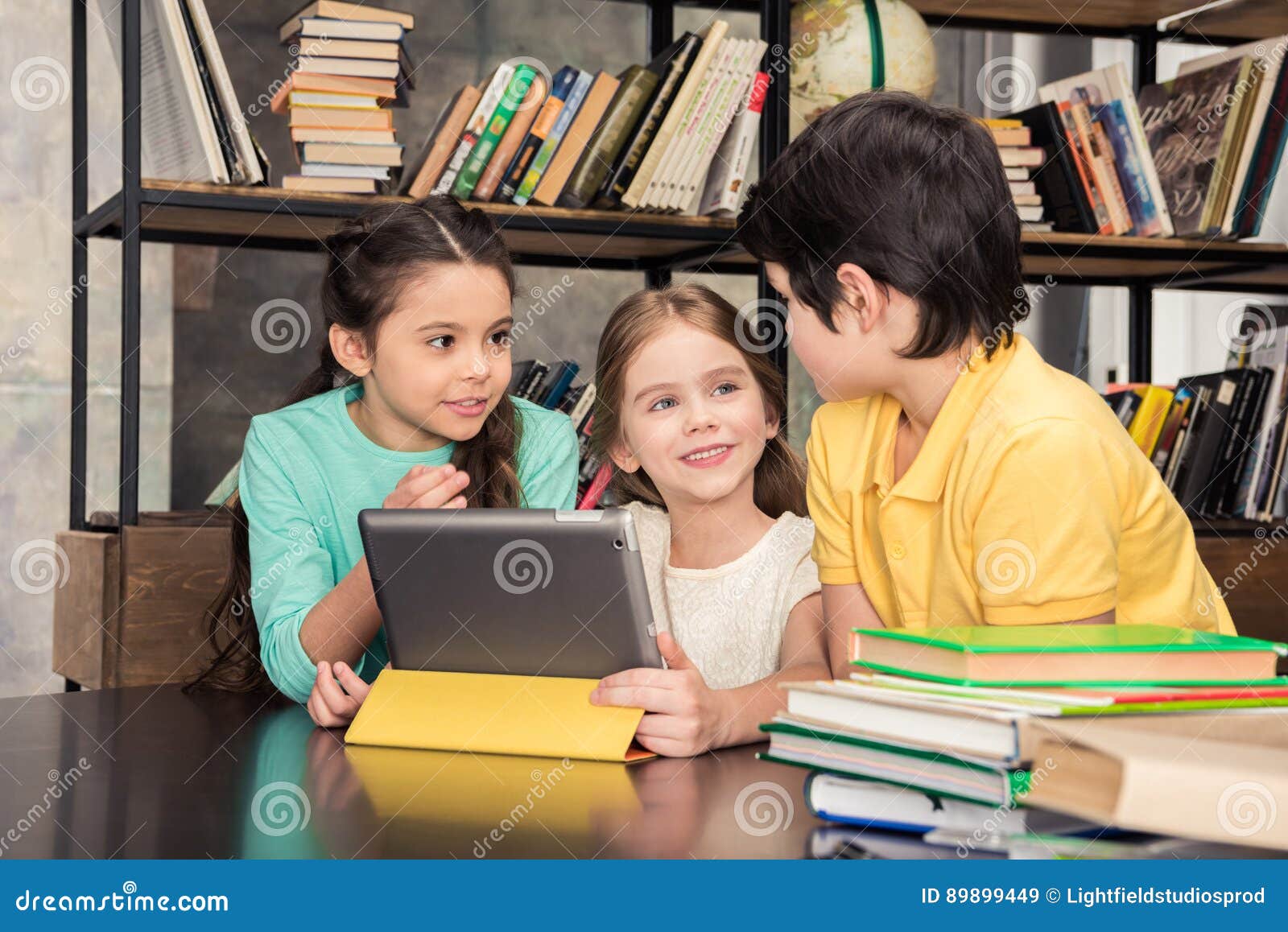 Children Using Digital Tablet and Looking at Each Other Stock Image ...