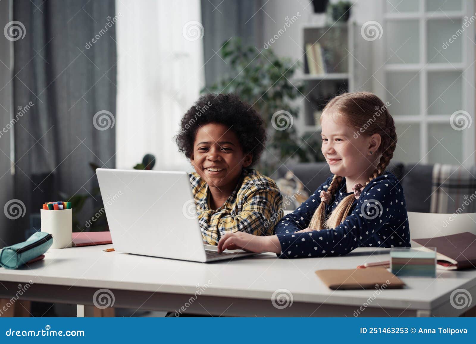 Children Using Laptop at Table at Home Stock Image - Image of video ...