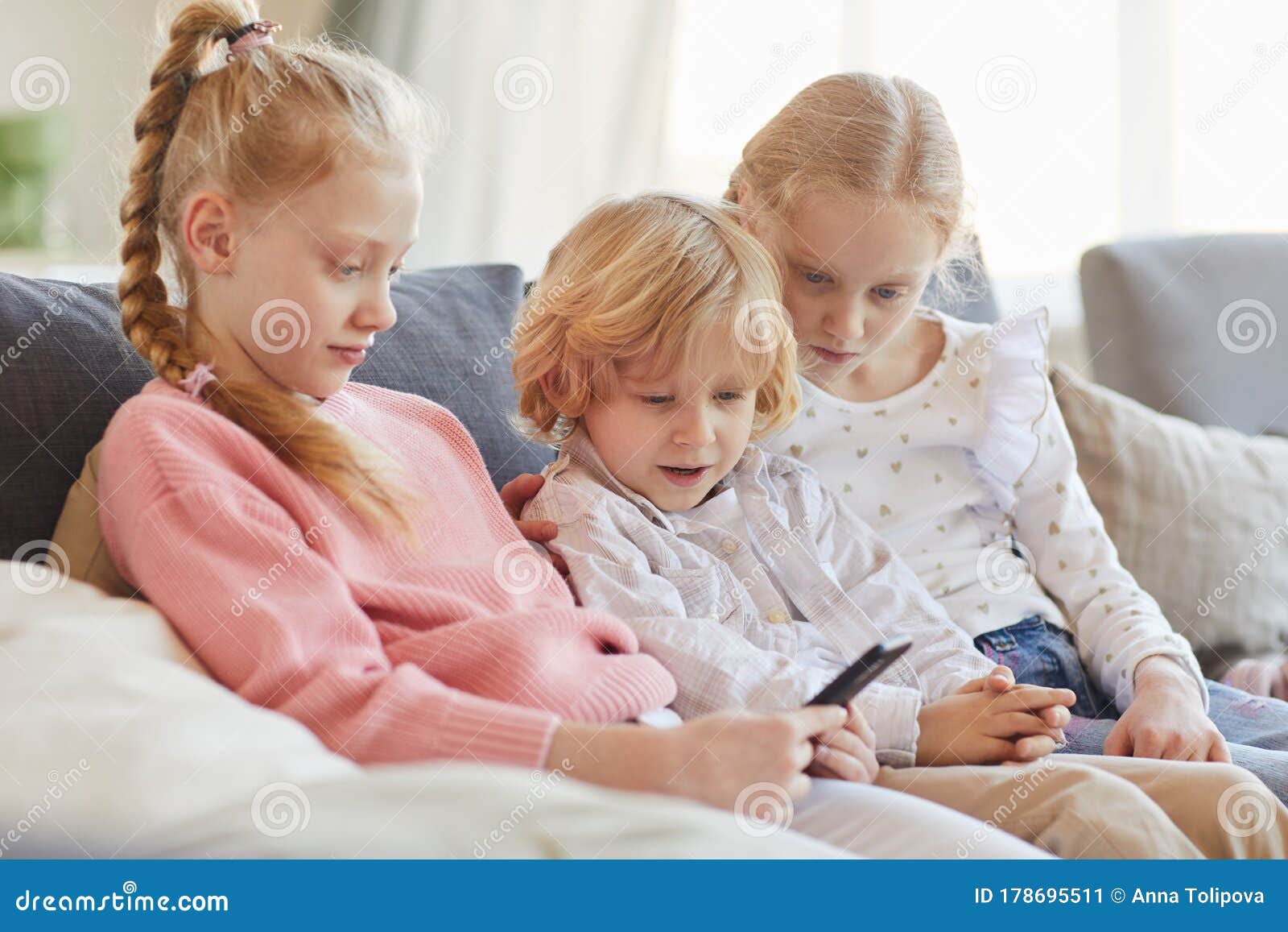 Children Using Phone at Home Stock Image - Image of boys, comfortable ...