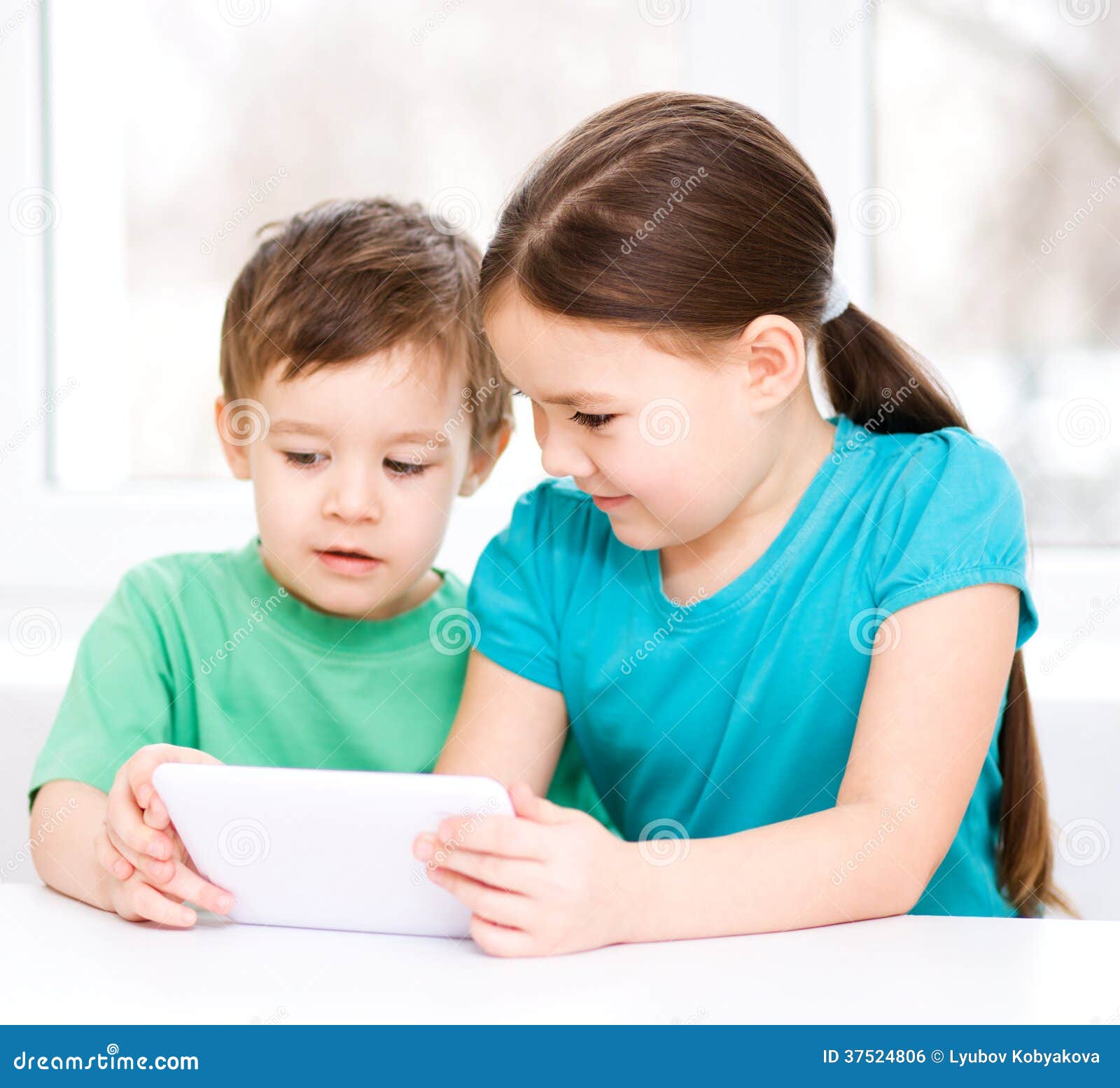 Children Using Tablet Computer Stock Photo - Image of home, lying: 37524806