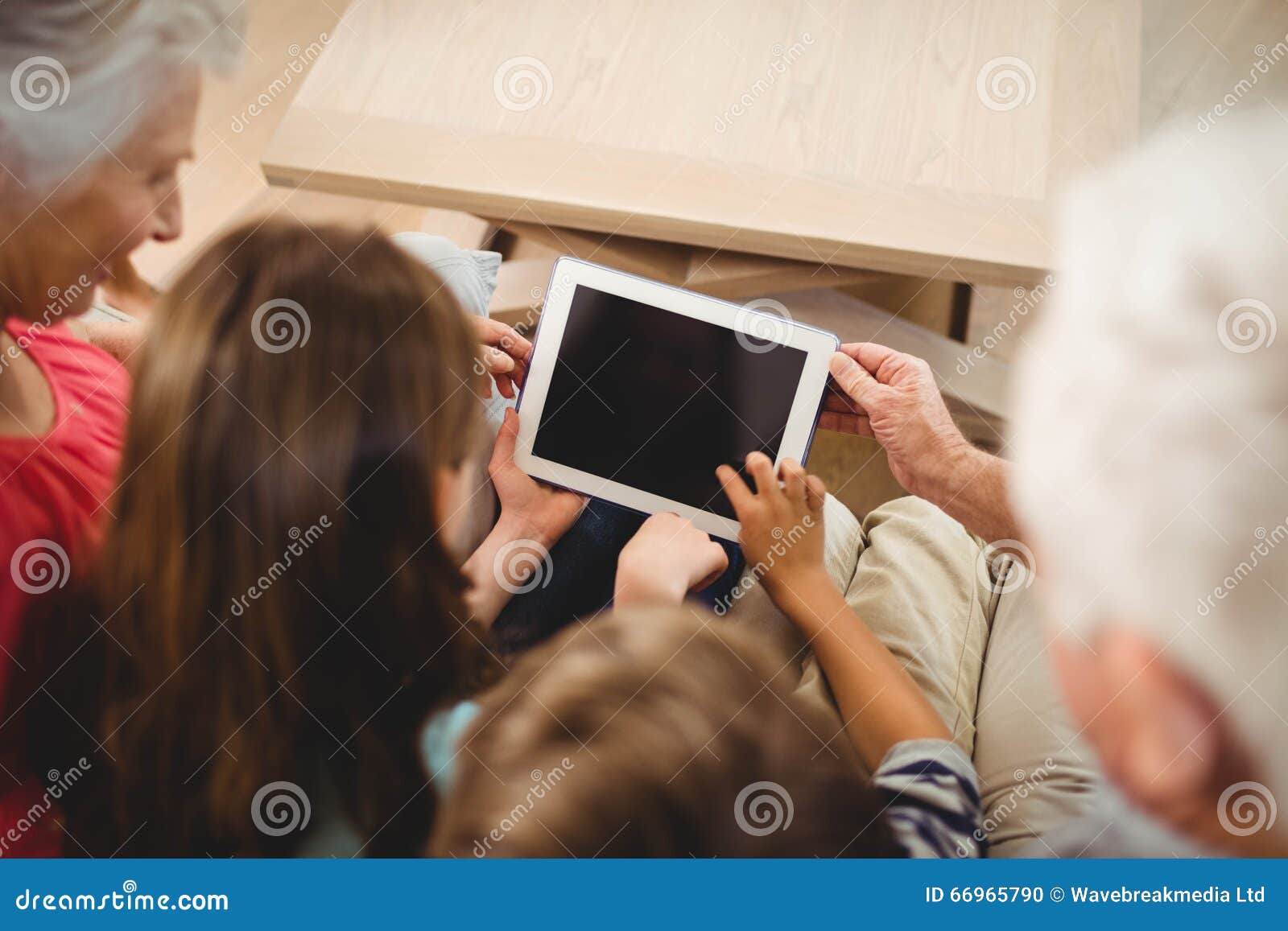 Children Using Tablet with Their Grandparents Stock Photo - Image of ...