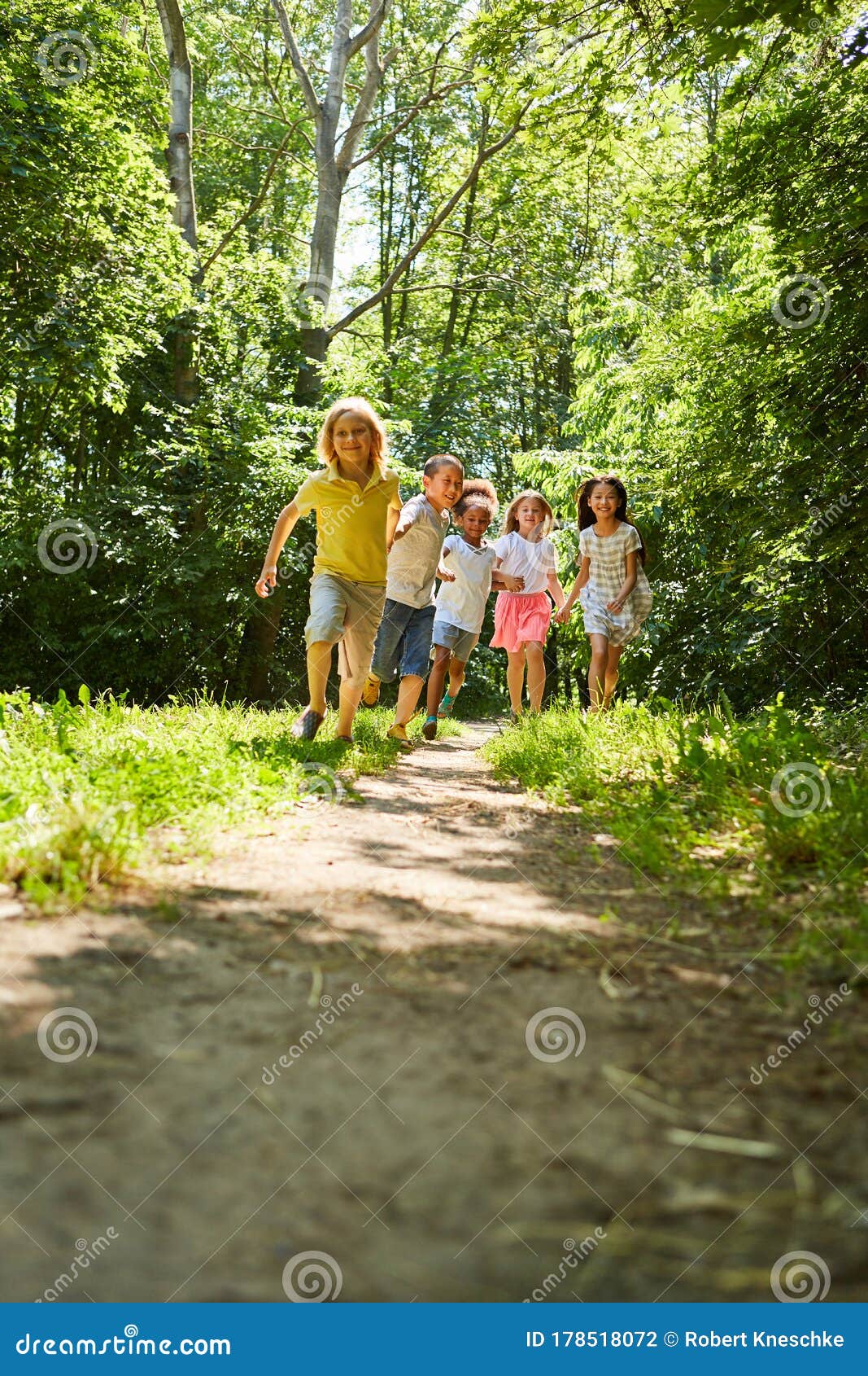 Children Walk Hand in Hand Over Meadow Stock Photo - Image of hand ...