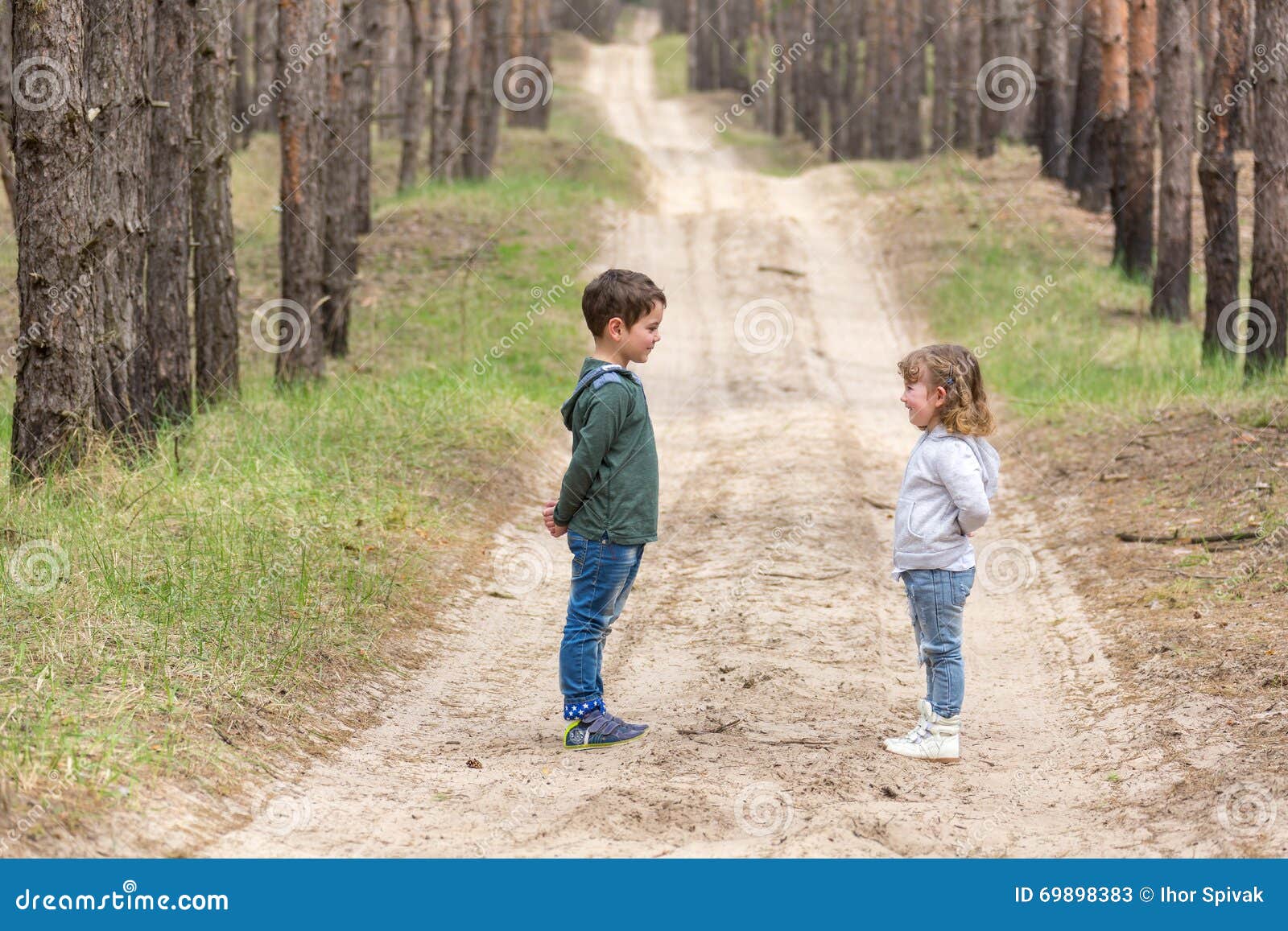 Children walking together stock image. Image of evergreen - 69898383