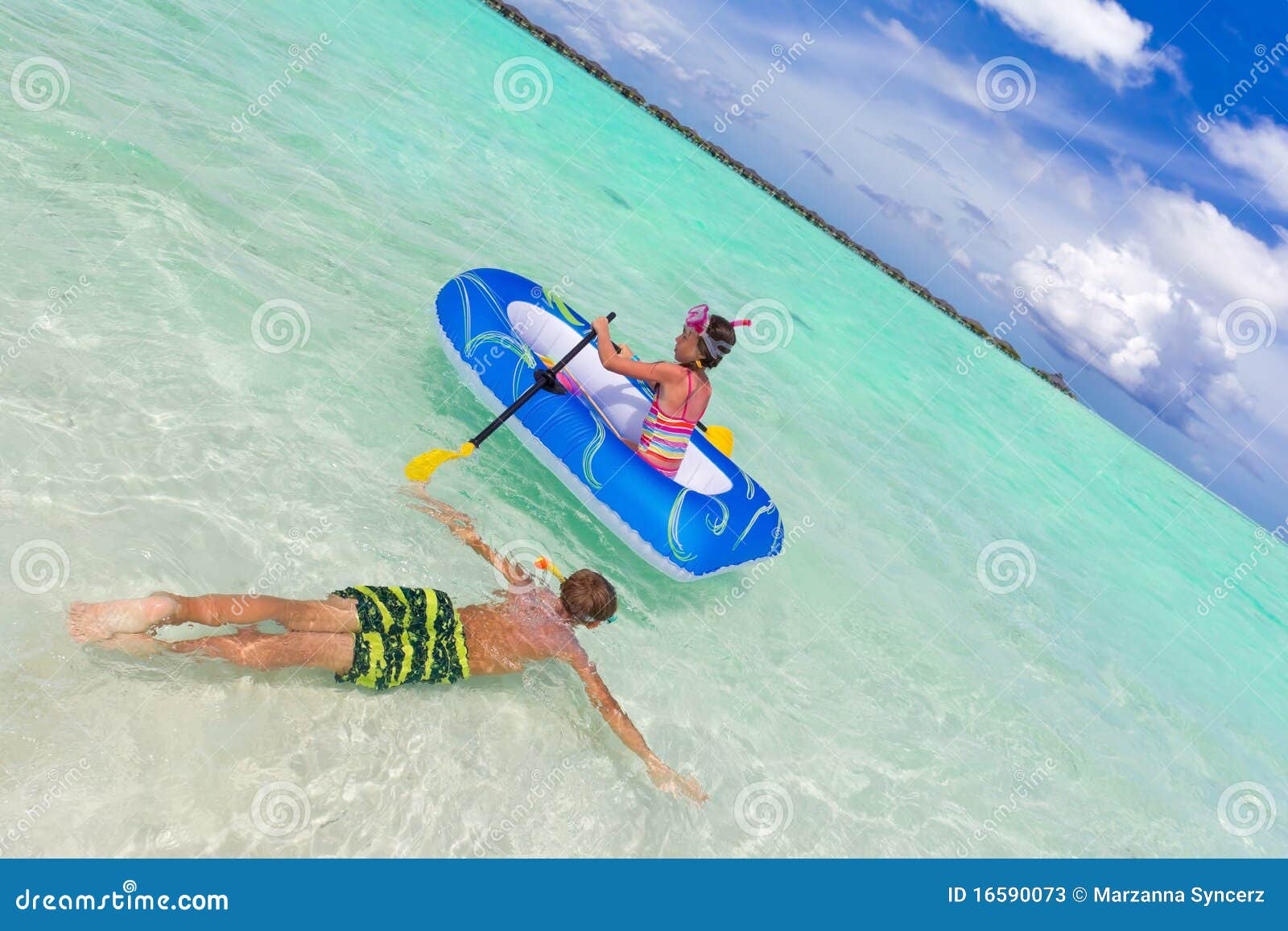 Children in water at beach stock image. Image of female - 16590073