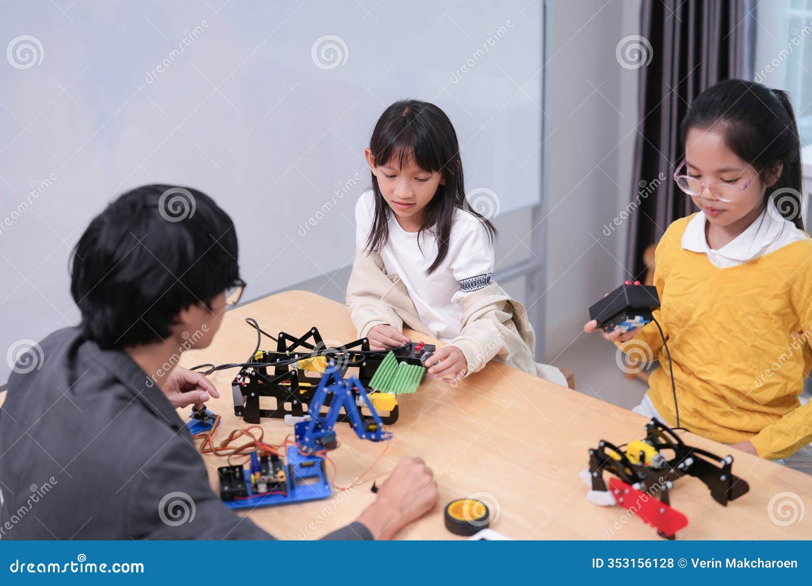 Children Working on Circuit Boards of Small Robot at Technology and ...