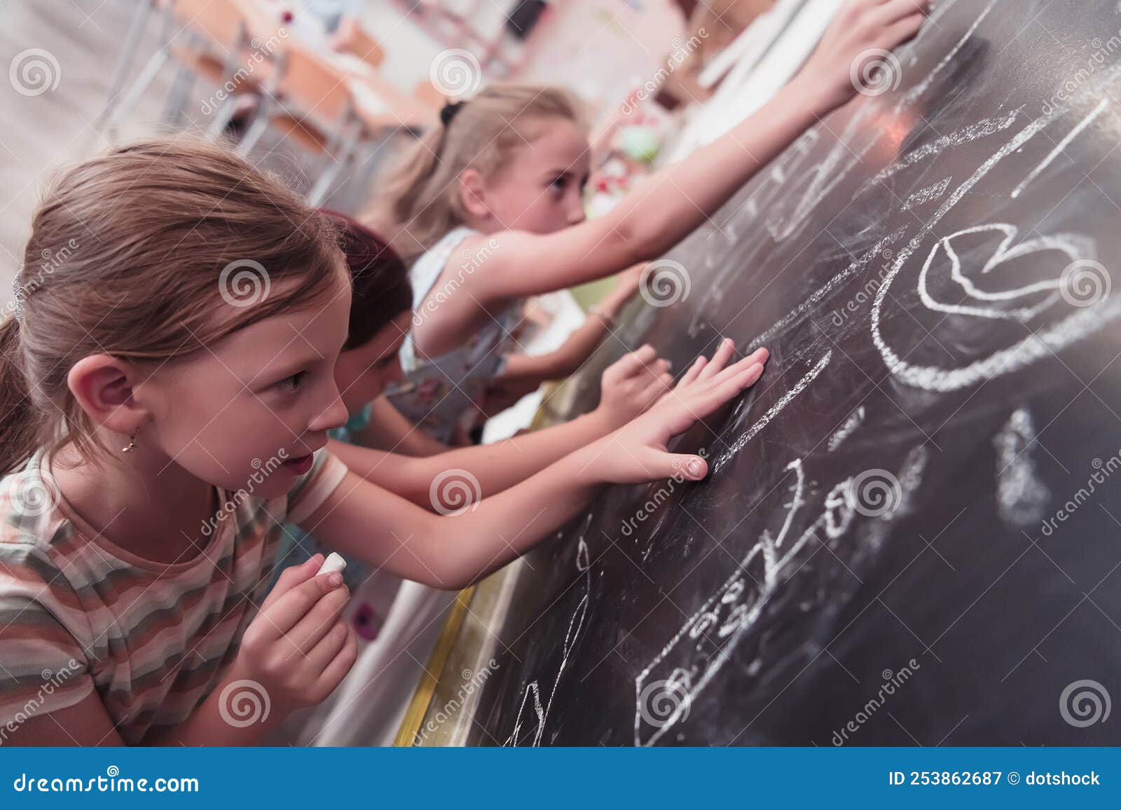 Children Write and Draw on the Blackboard in Elementary School while ...