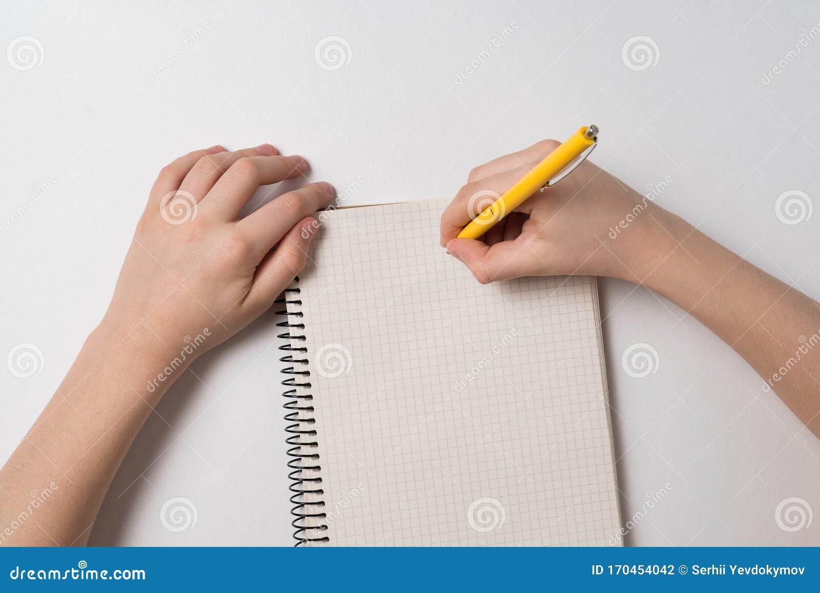 Childrens Hands Writing in Notebook. Child Doing Homework Stock Photo ...