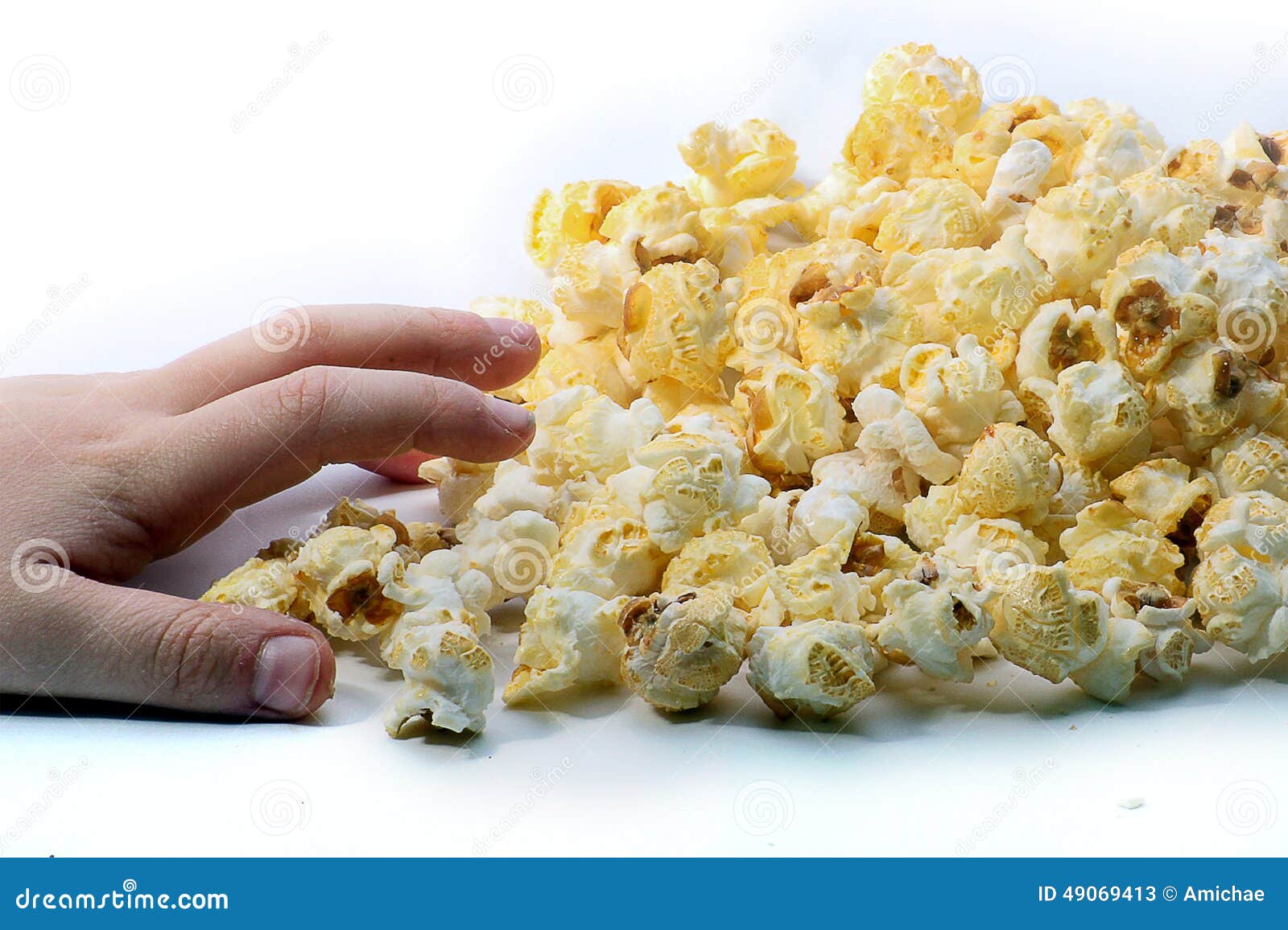 A Childs Hand Reaching for Some Popcorn Stock Image - Image of hand ...