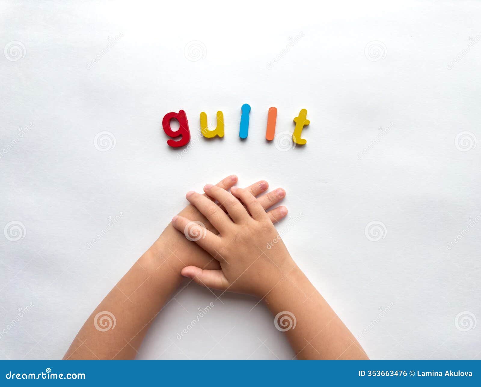 Childs Hands and Colorful Guilt Text on White Background Stock Photo ...