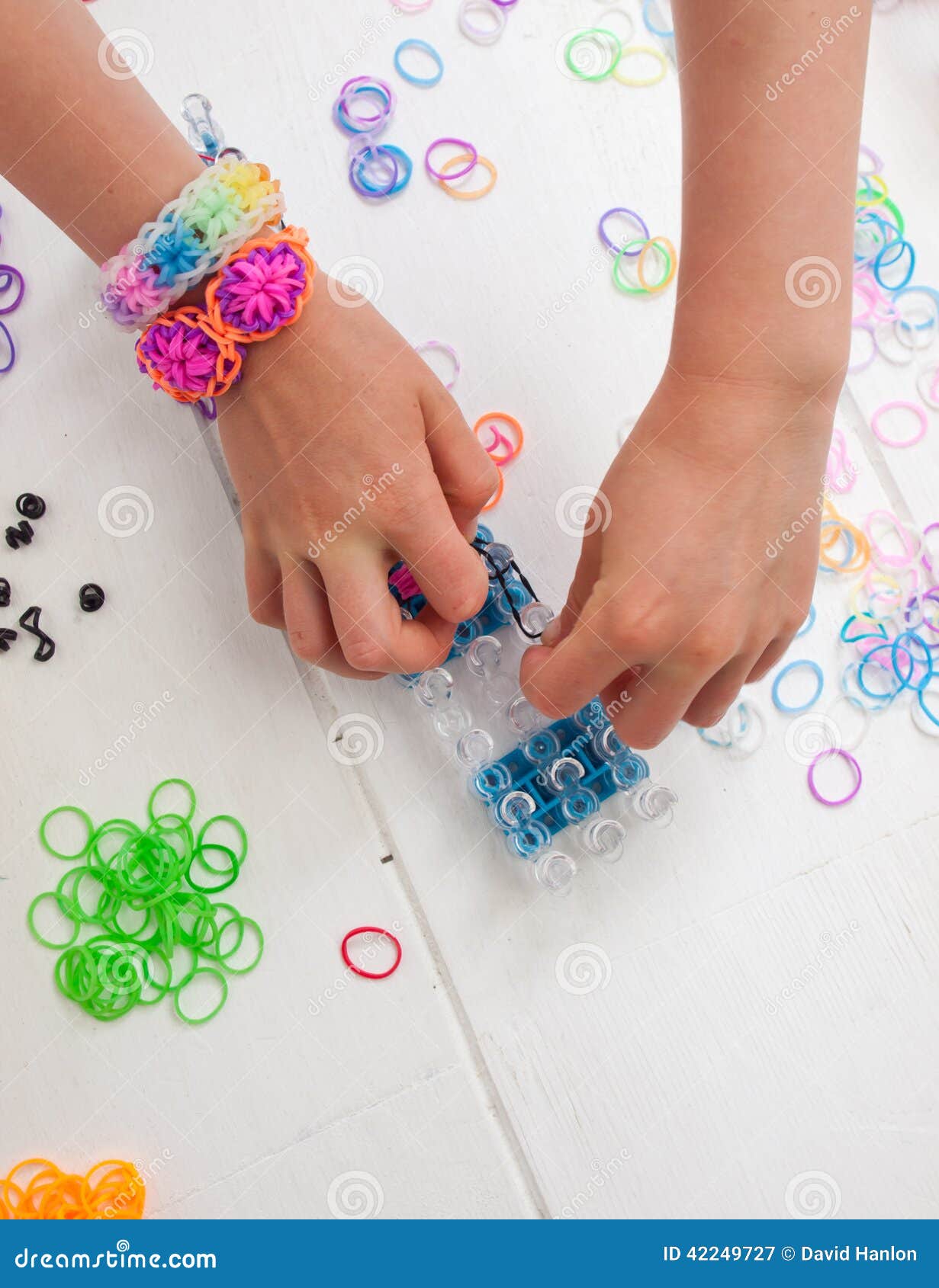 Childs Hands with Loom and Multicoloured Elastic Bands Stock Image ...