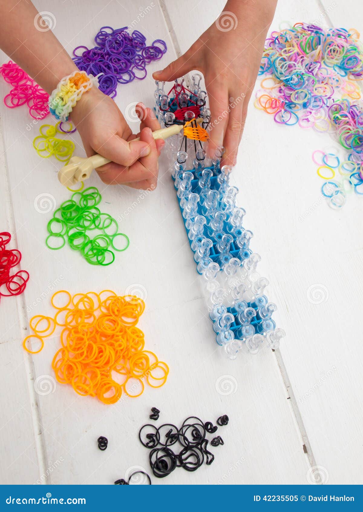 Childs Hands Making a Bracelet on a Band Loom Stock Image - Image of ...