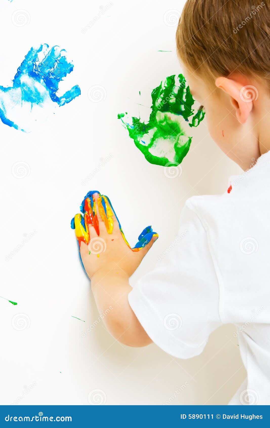 Childs Messy Painted Hands on the Wall Stock Image - Image of play ...