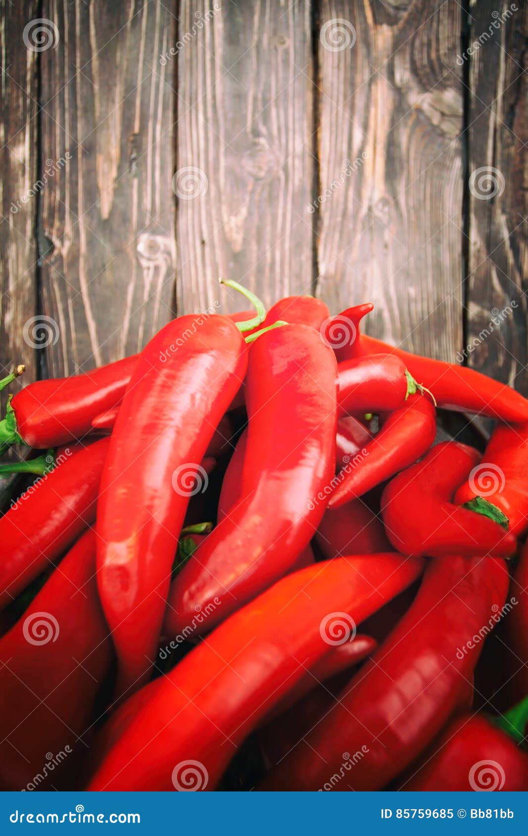 Chili peppers on a table stock image. Image of multi - 85759685